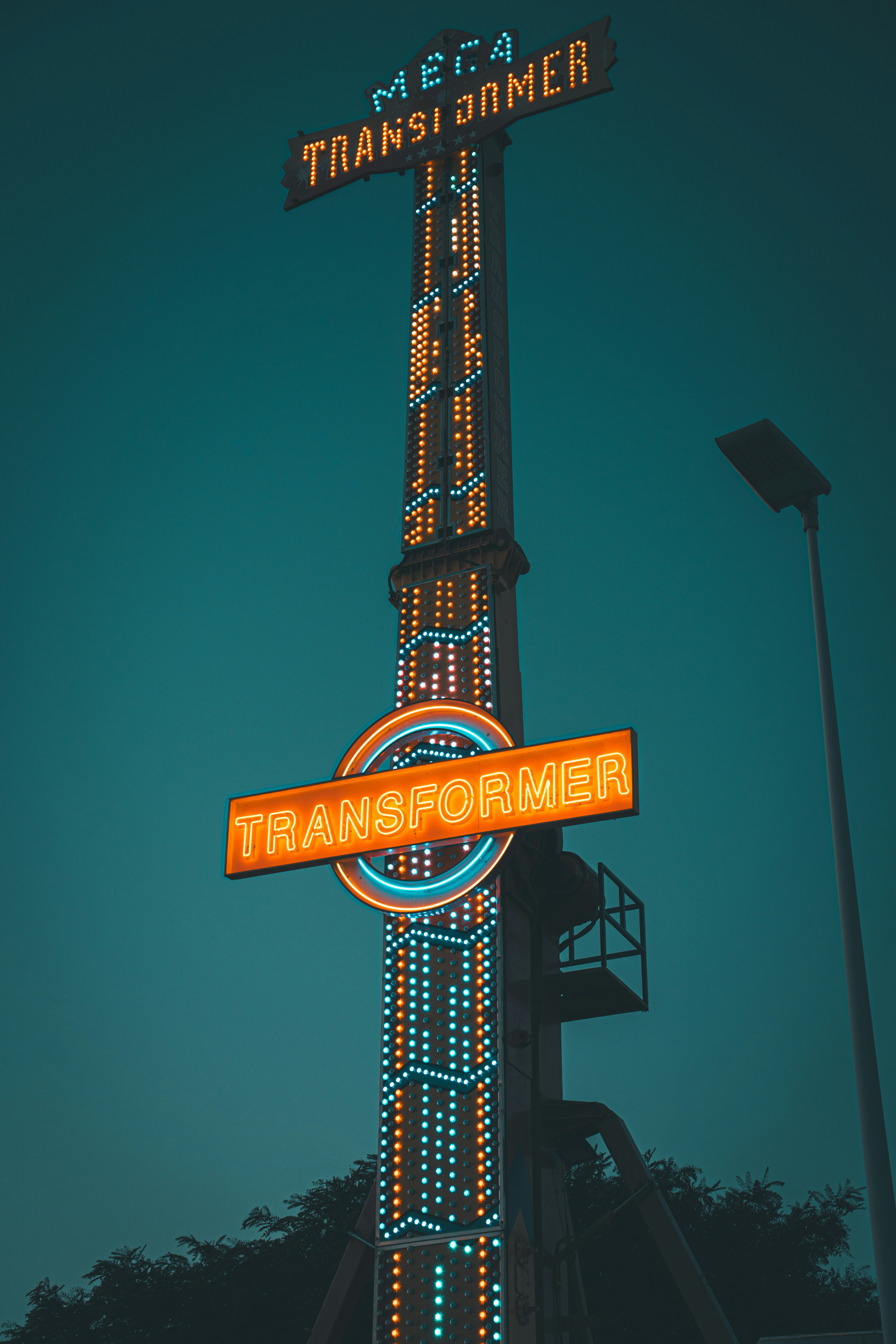 Transformer Neon Tower at Dusk: A Retro-Futurist Signpost