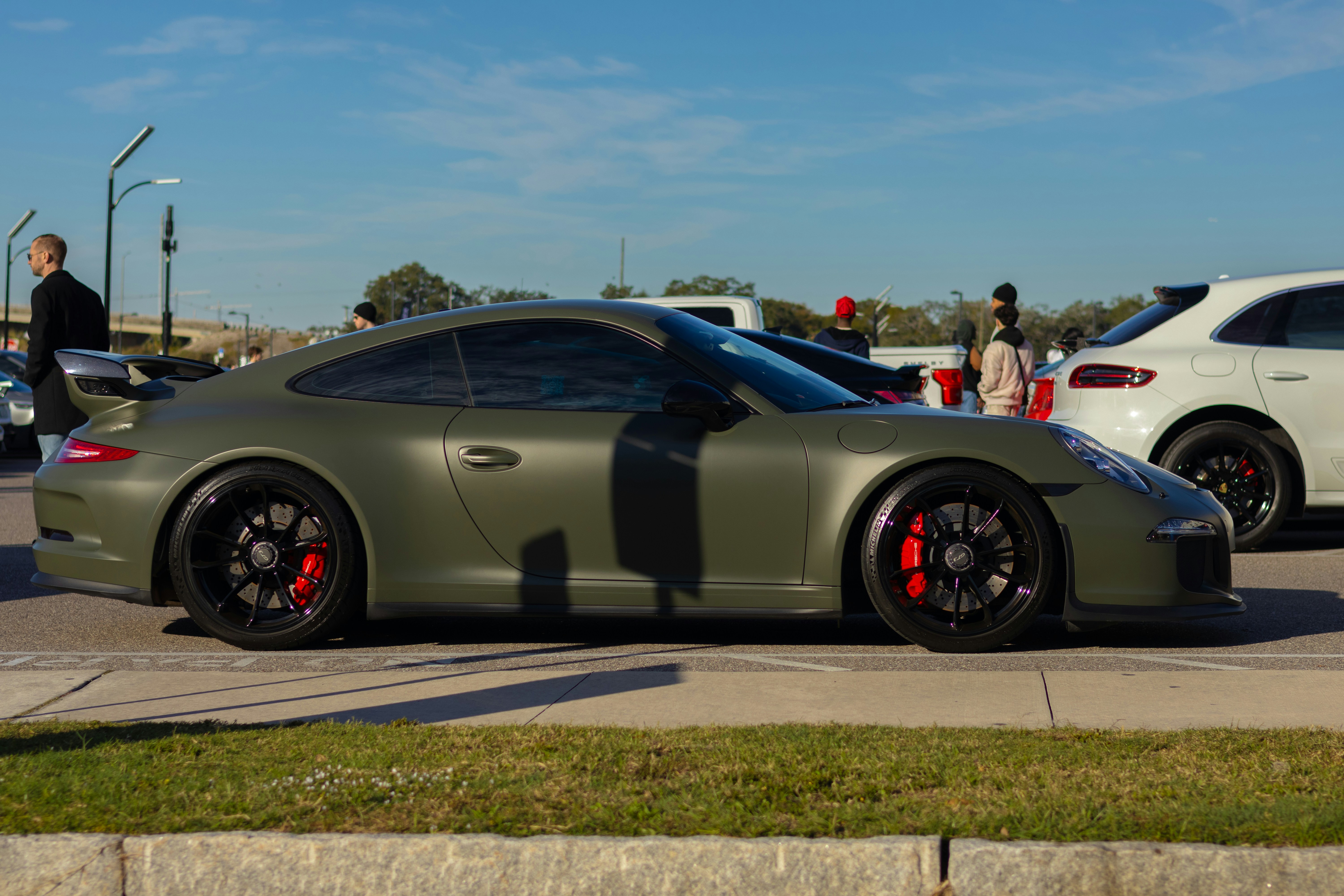 a green sports car parked in a parking lot