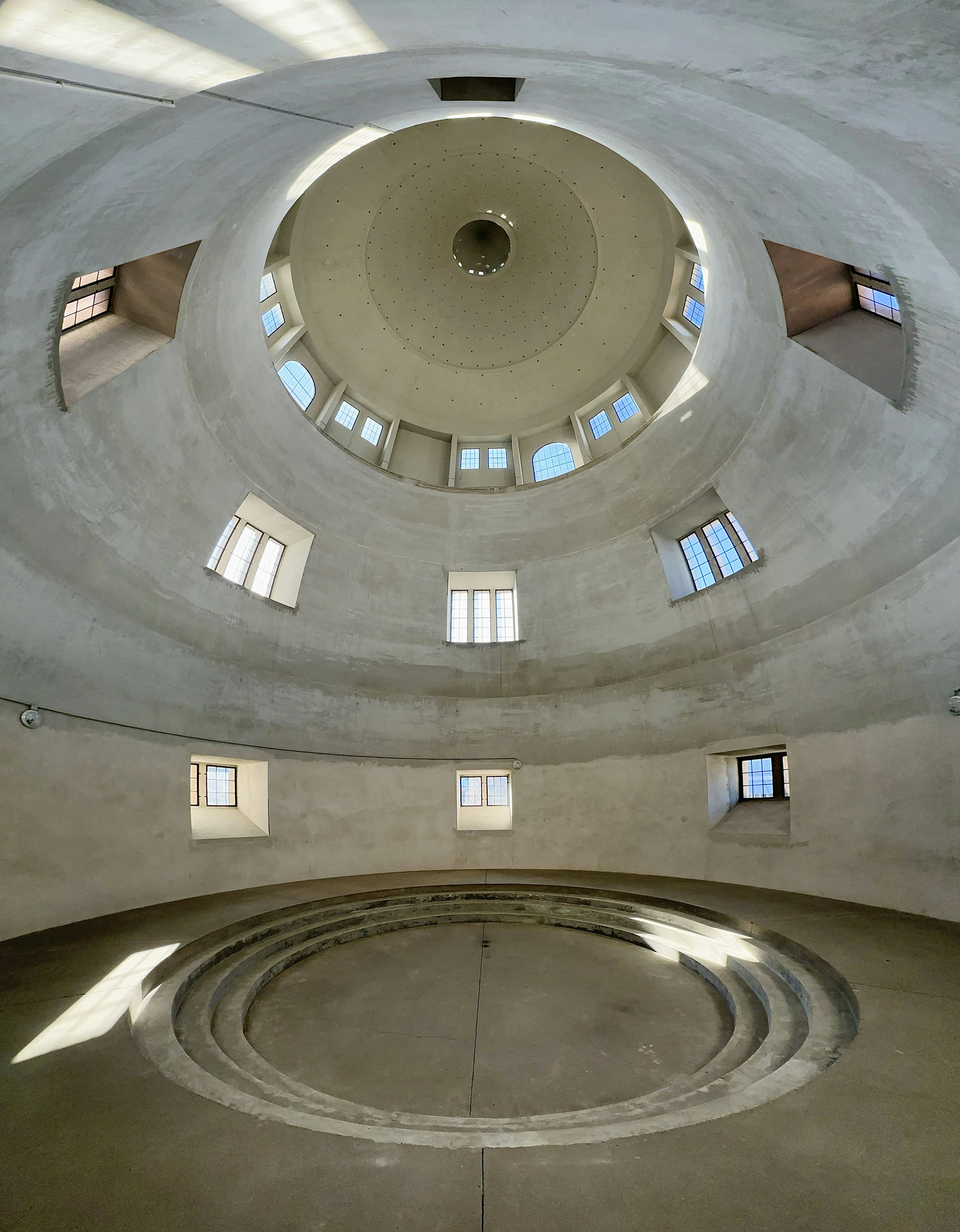 A circular room with windows and a spiral staircase photo – Free ...