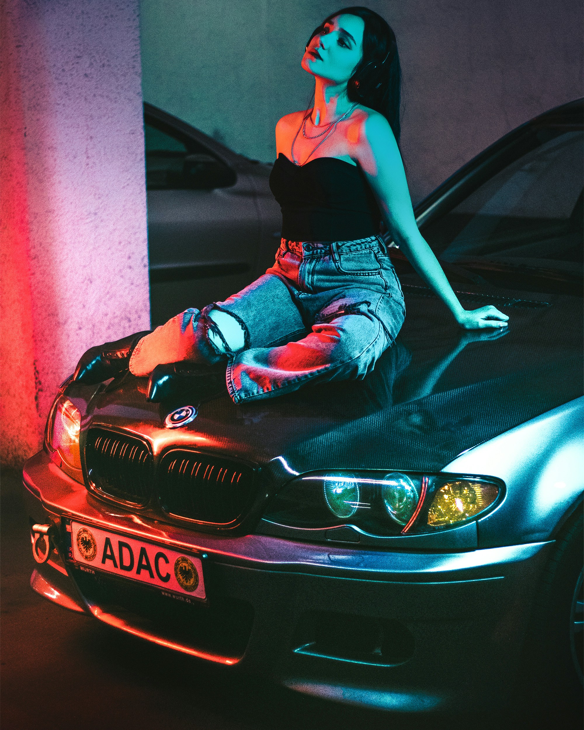 Neon Velvet on Chrome: A Neon-Tinted Portrait Across a Car Hood