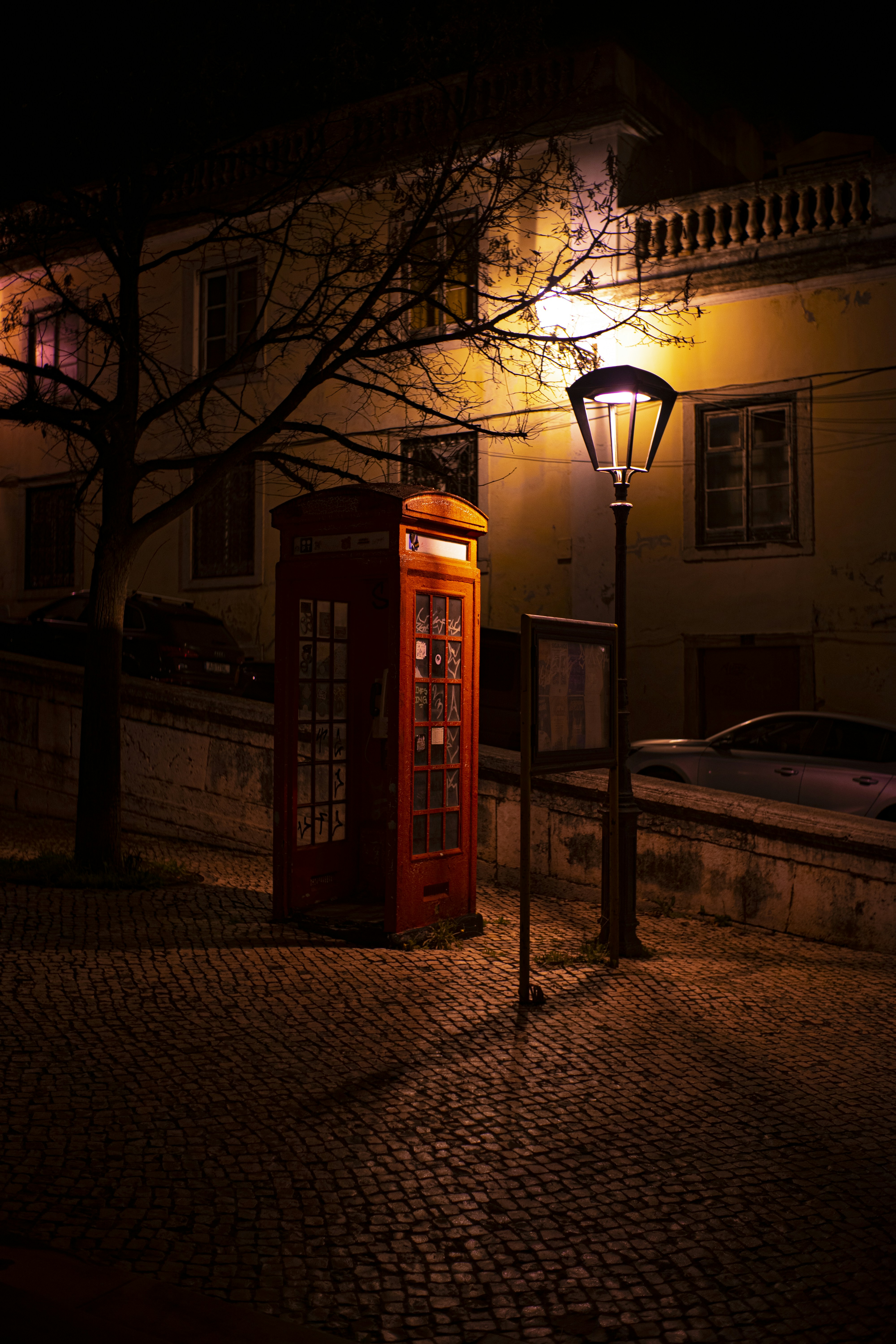 Whispers of the Night: A Vintage Callbox in Urban Stillness