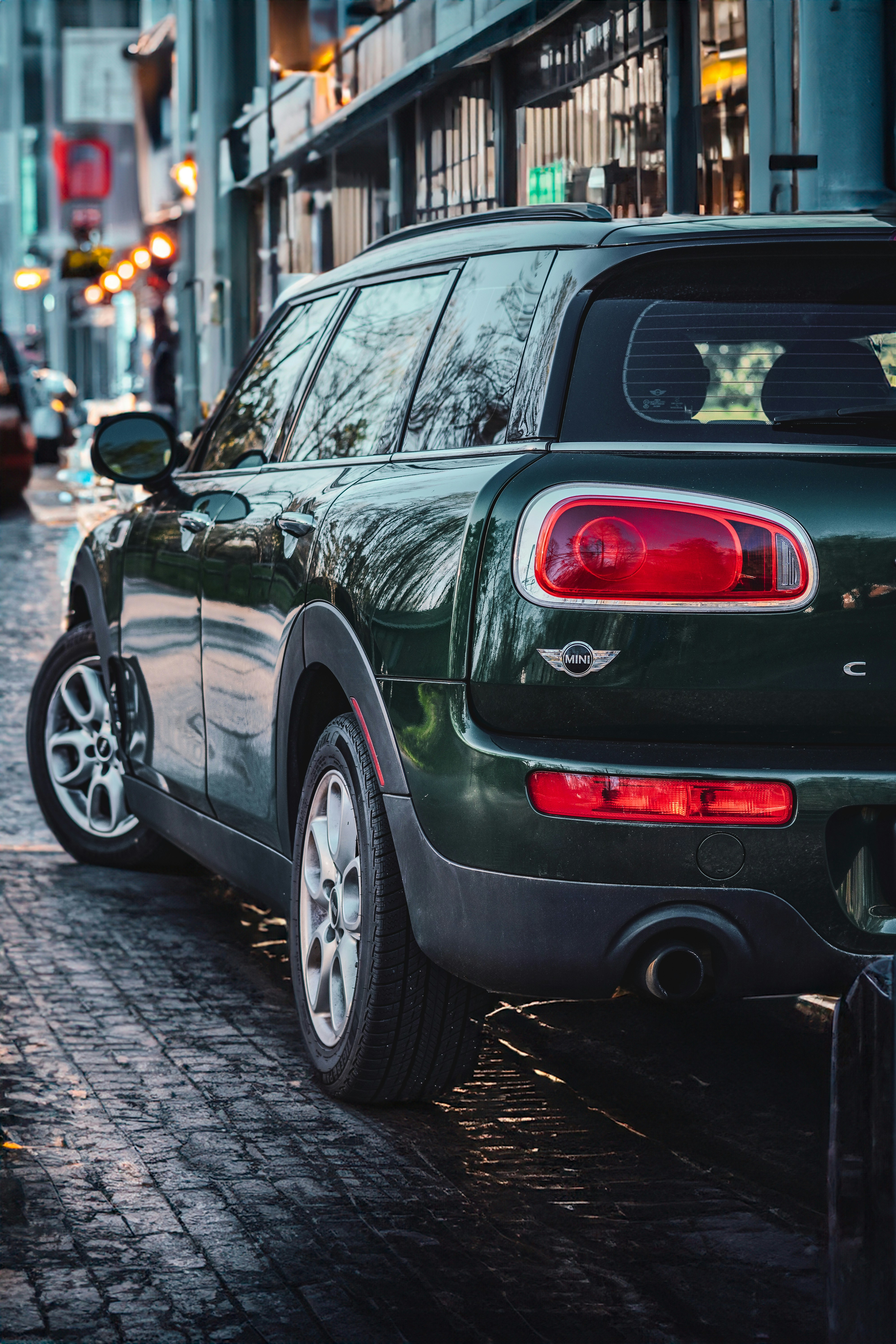 A green minivan parked on the side of the road photo – Free Mini cooper ...