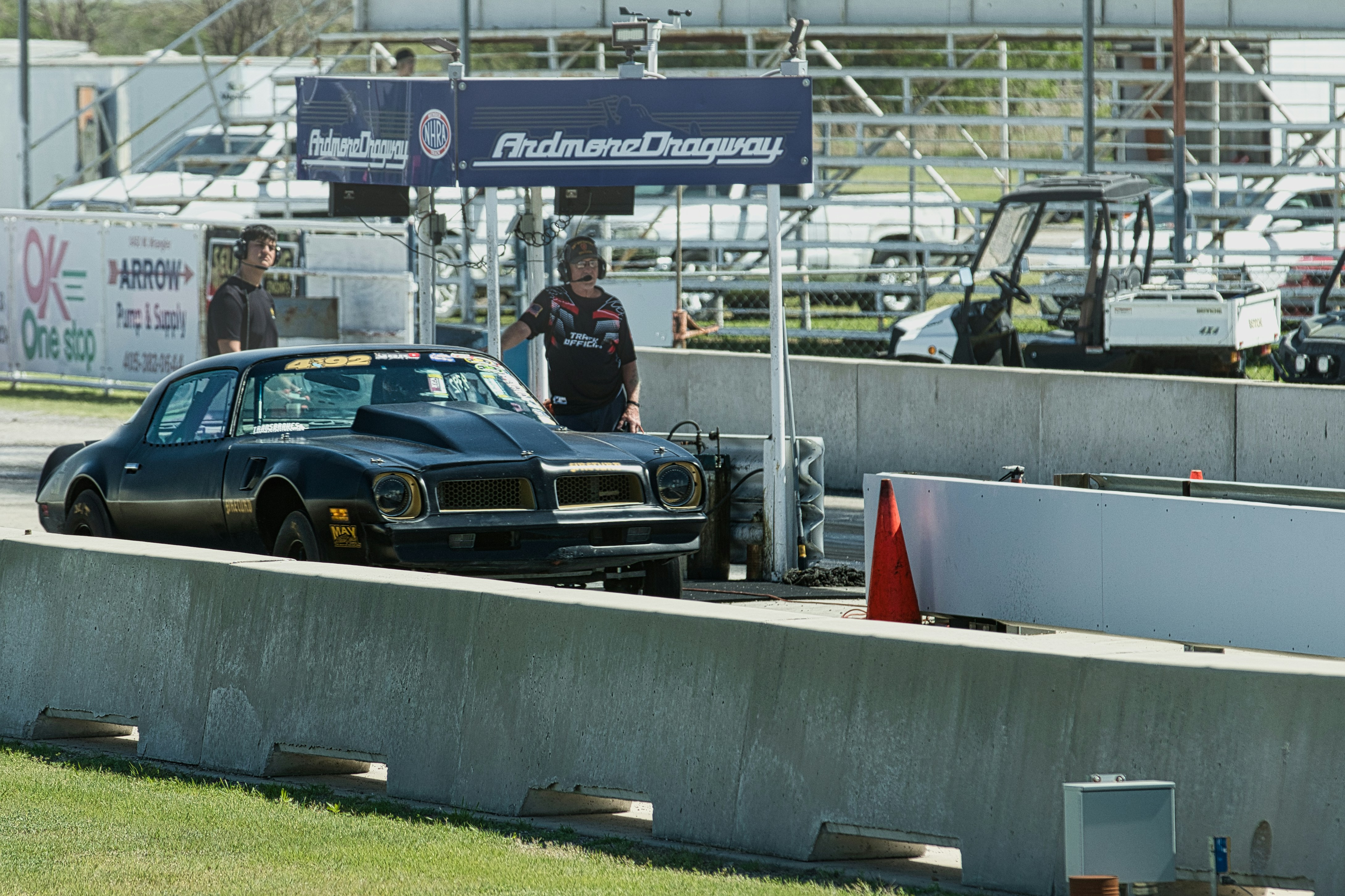 A car being worked on at a drag track photo – Free Black Image on Unsplash