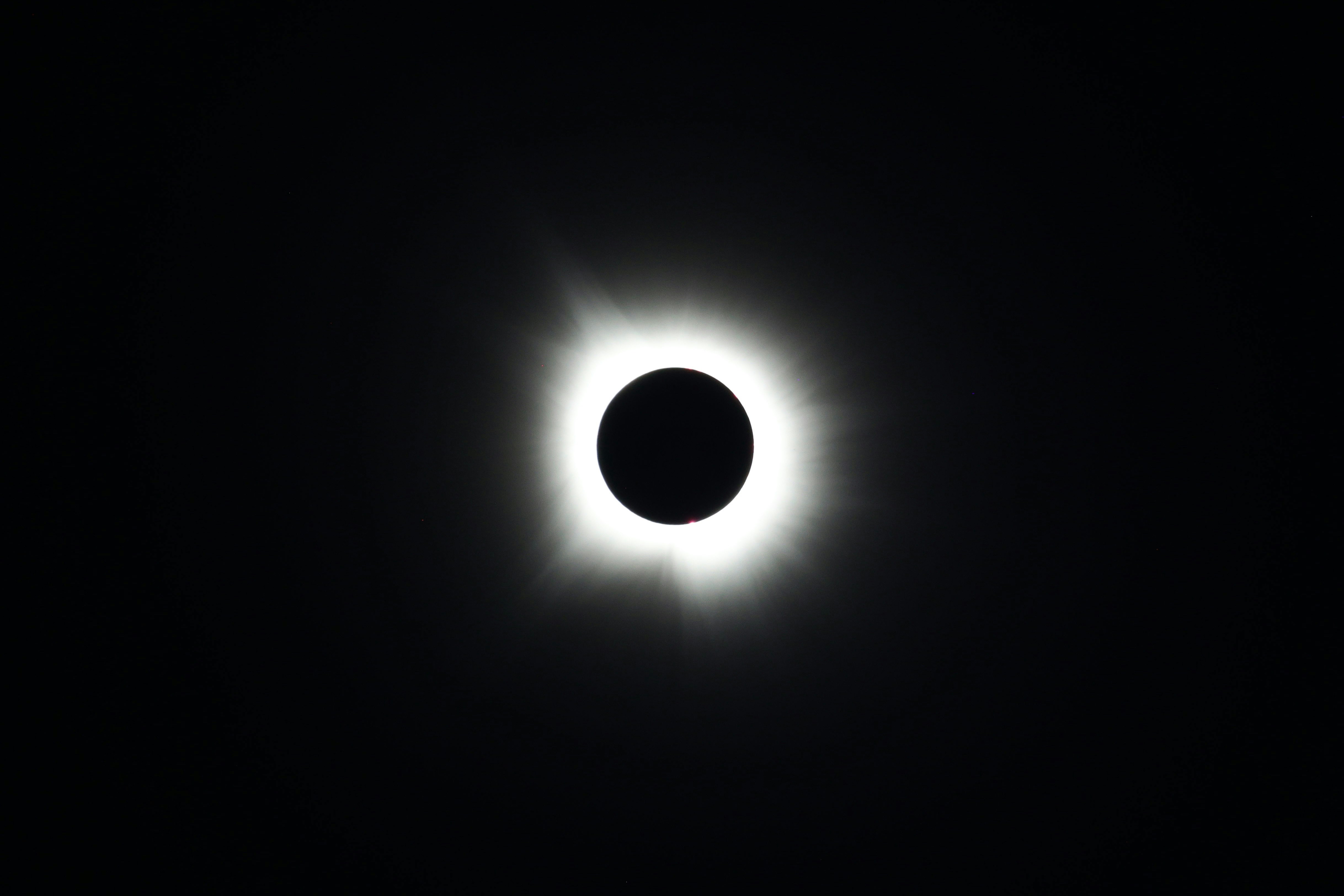 A solar eclipse is seen in the dark sky photo – Free Dallas Image on ...