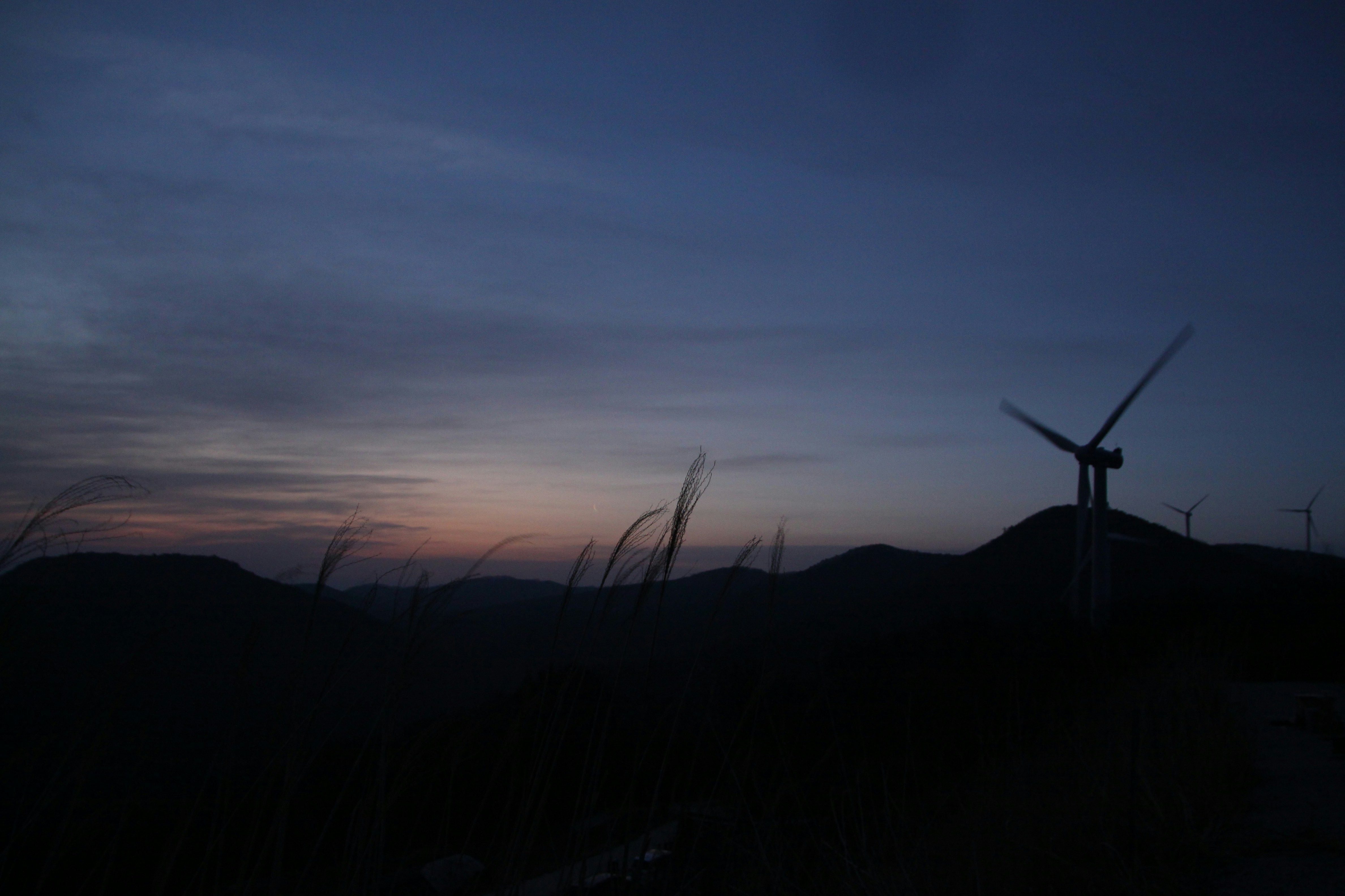Dusk on the Ridge: Silent Wind Turbines Carve the Horizon