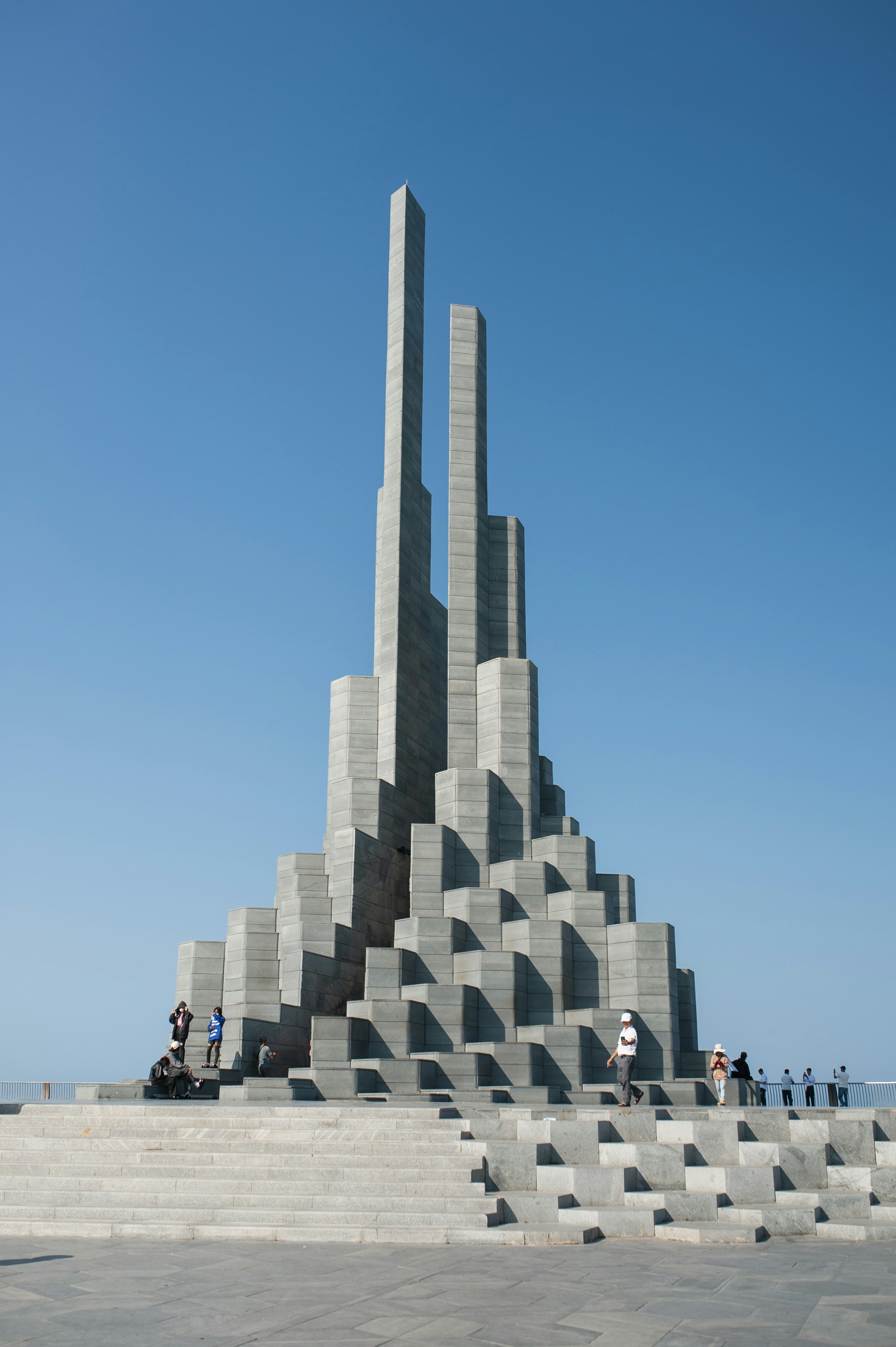 Tiered Monoliths Ascend: A Concrete Skyline Sculpture