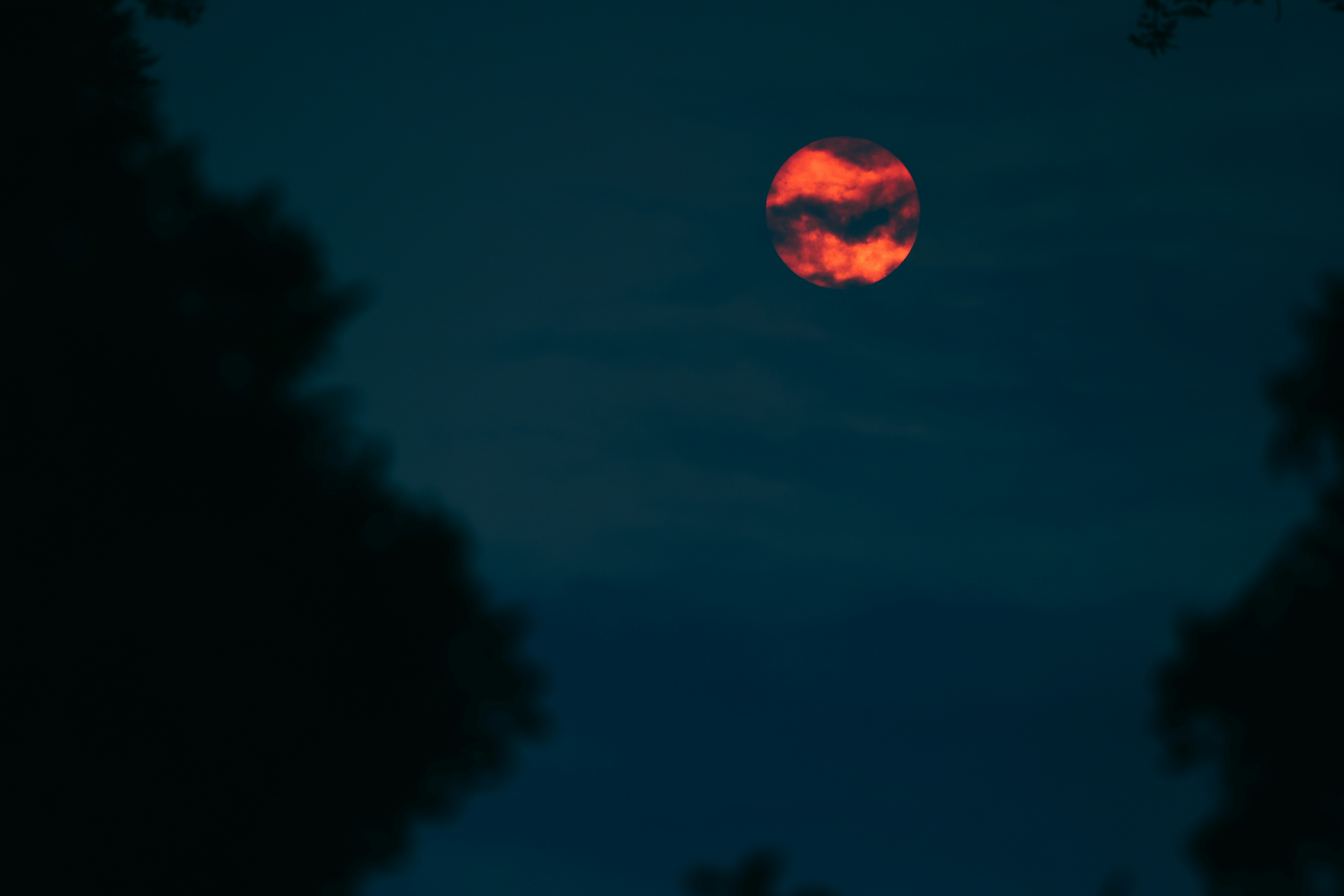 Red Moon Over a Quiet Twilight Corridor