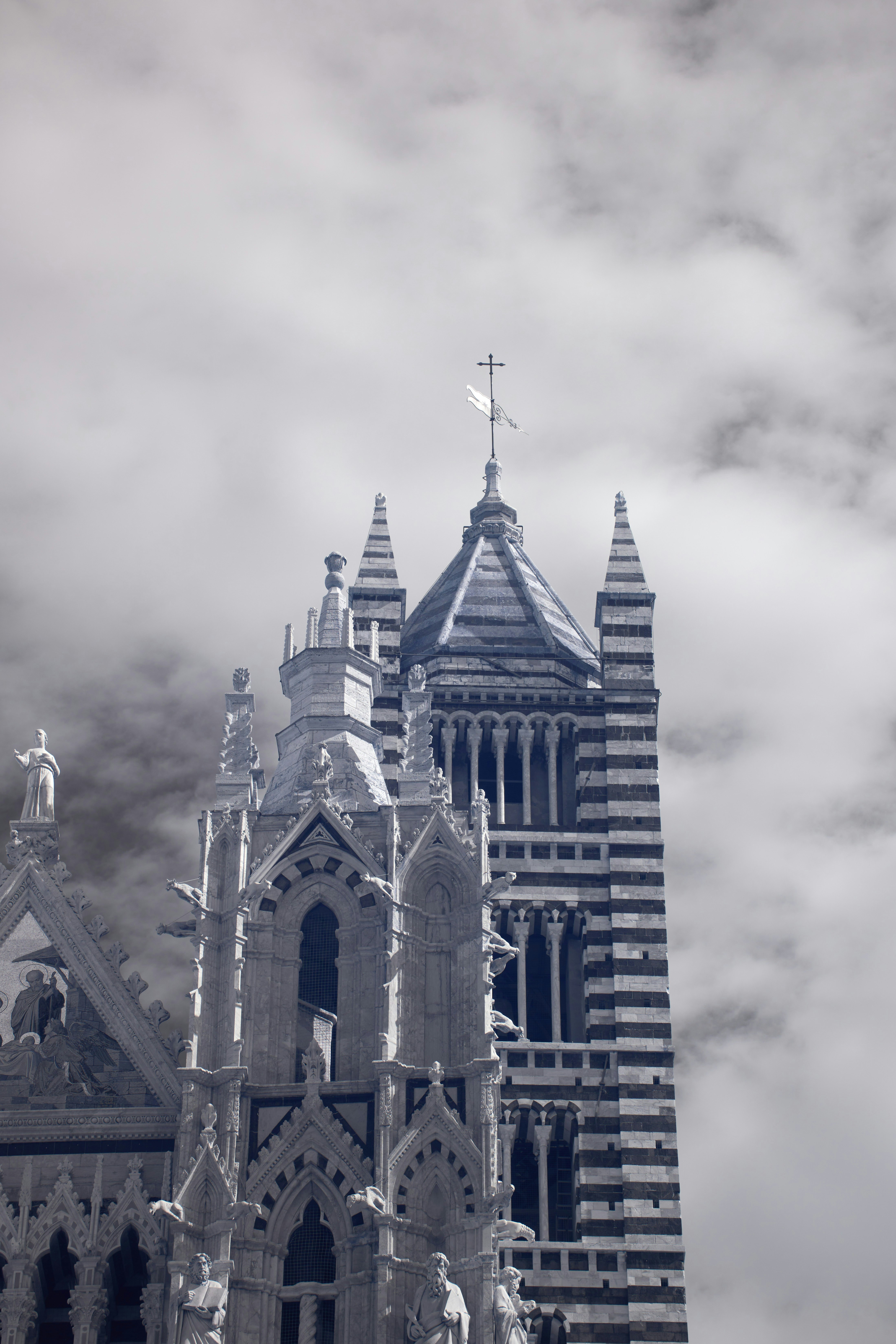 a church with a steeple and a cross on top