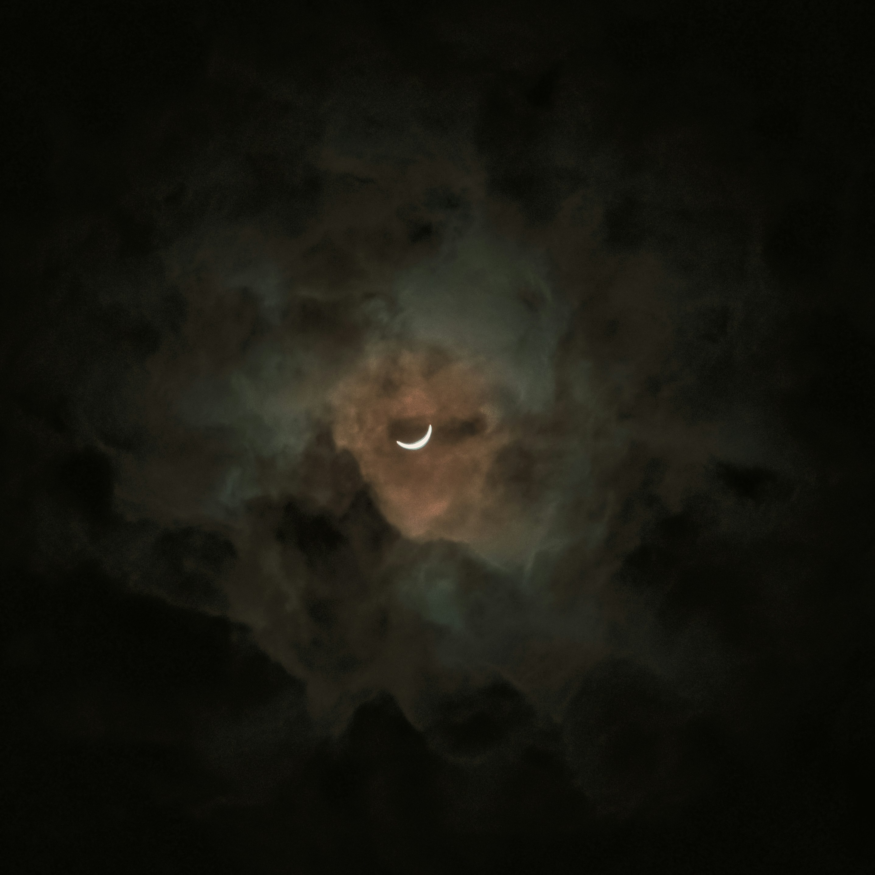 Crescent Among Cloud Veils: Night Portrait of Subtle Radiance