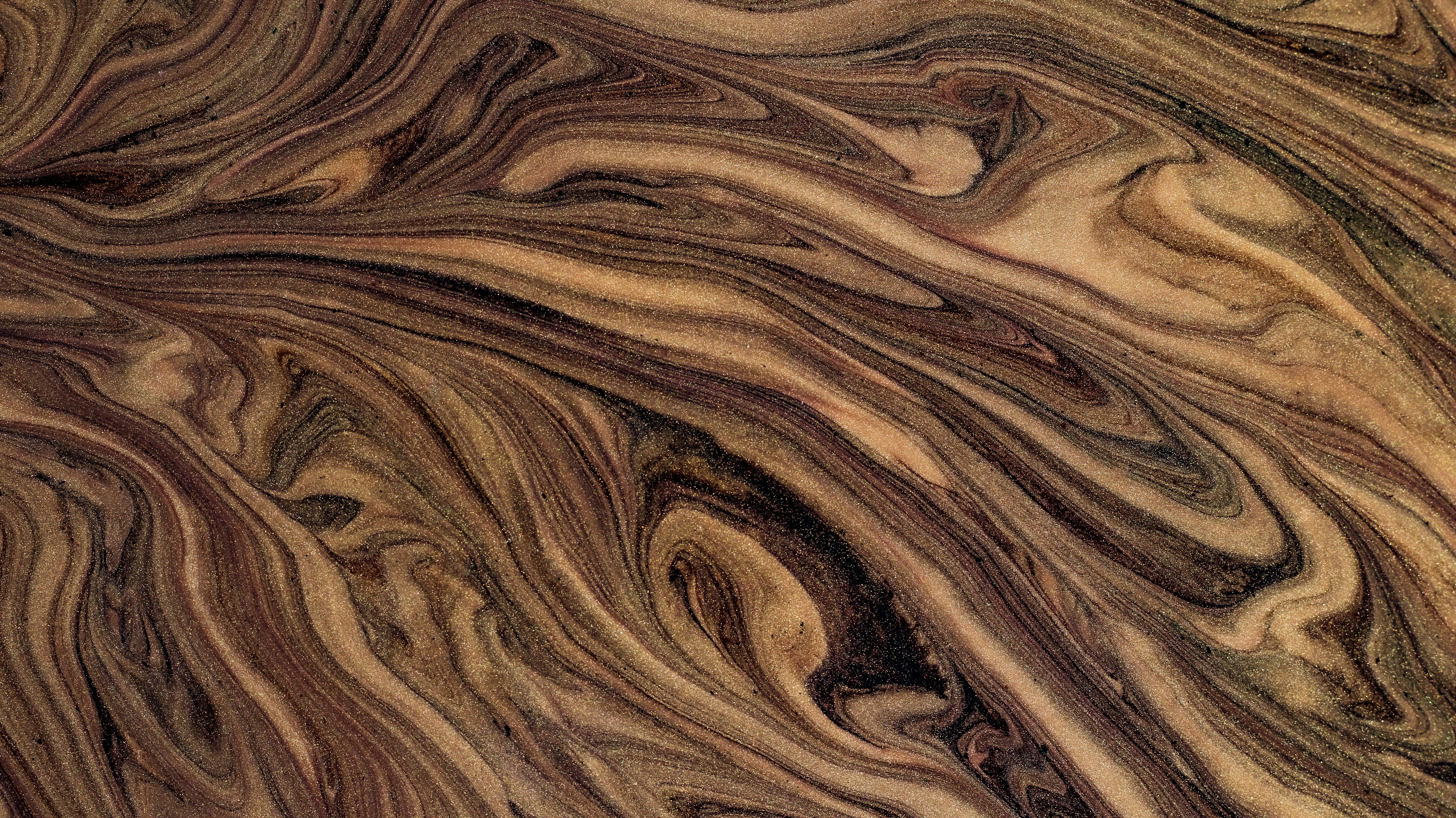 Marbled Currents: Veins of Earth in Subtle Brown Tides