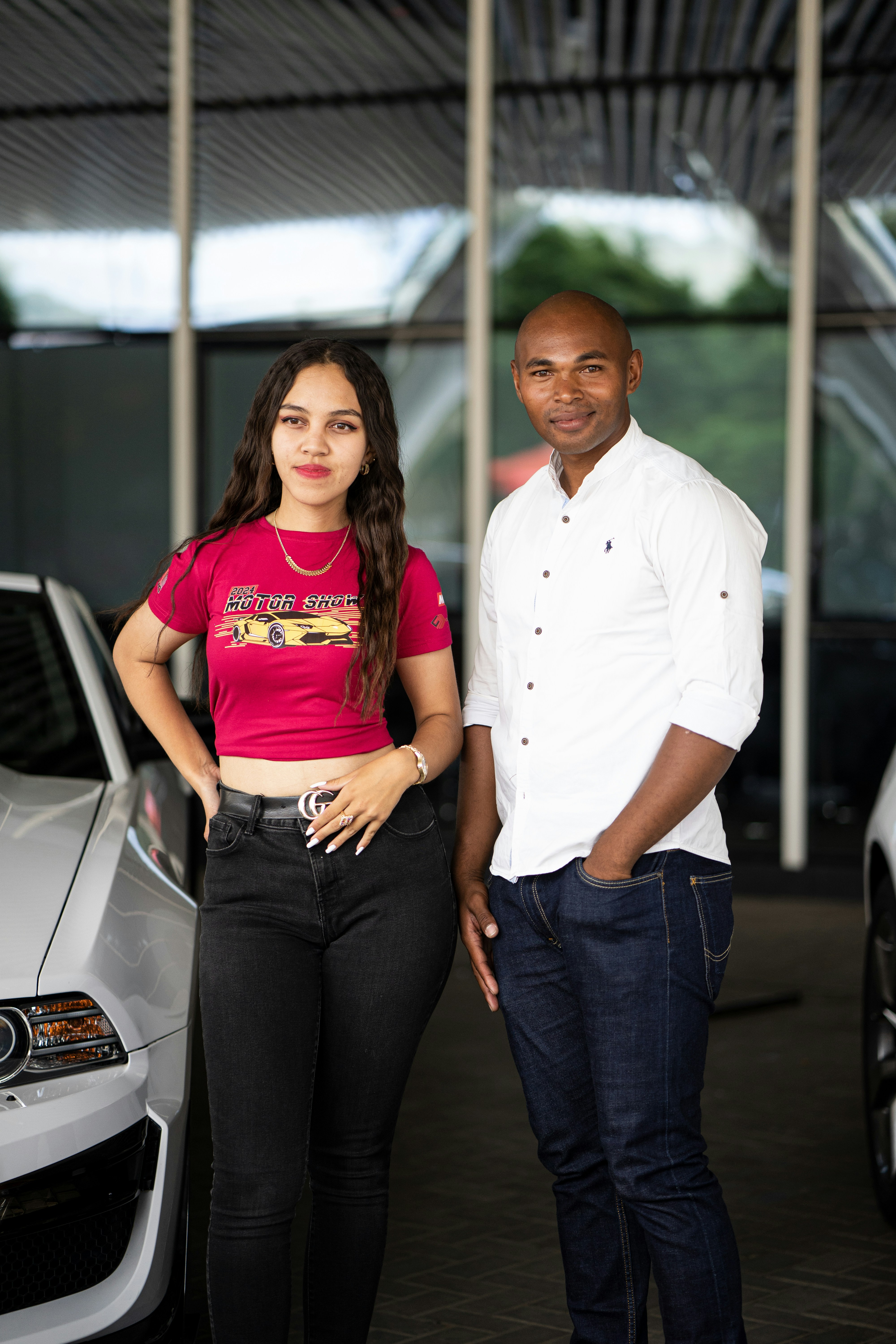 Two Vehicles, One Showroom: Casual Confidence by the Cars