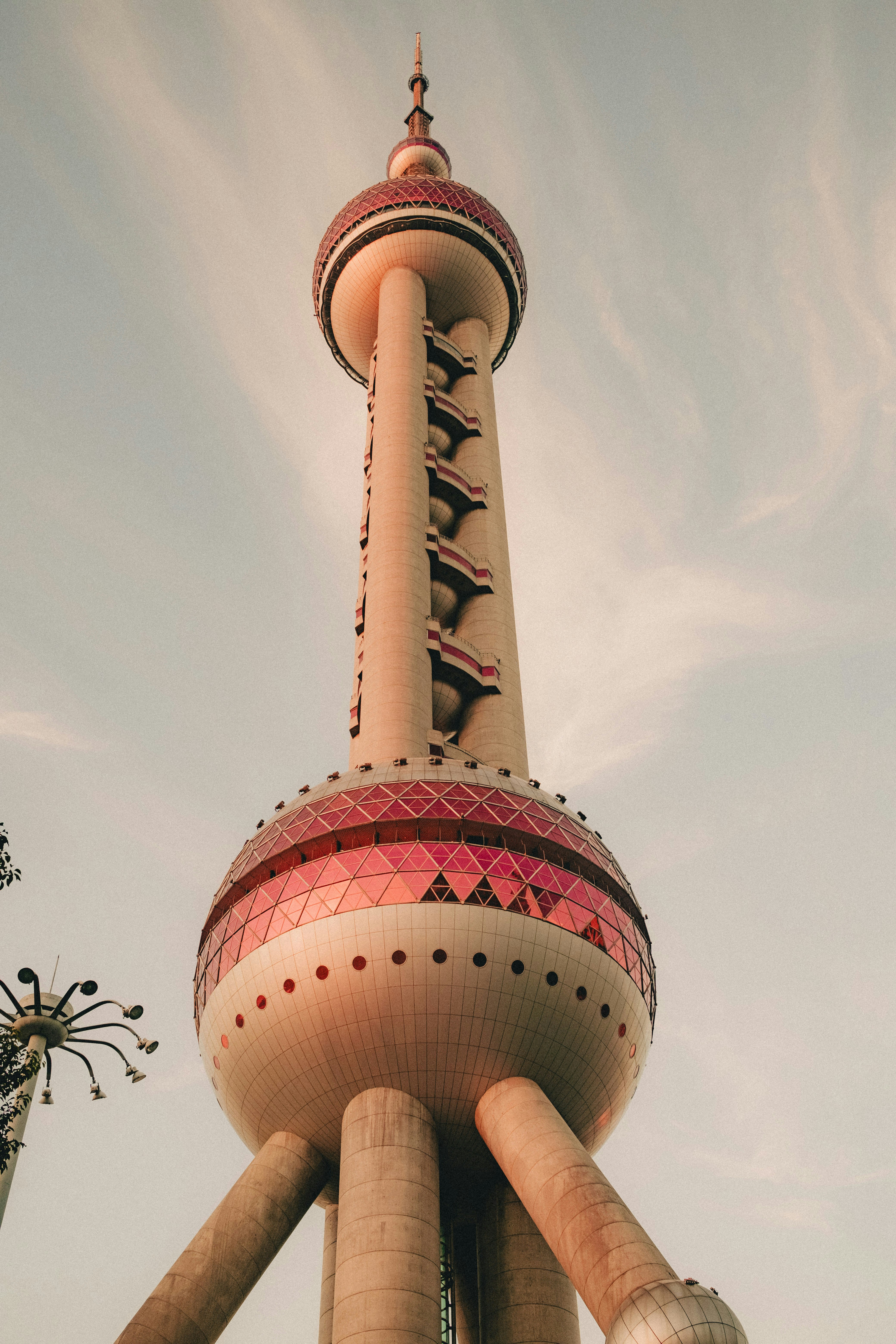 Rosy Ascension: Ground-Level View of Shanghai's Pearl Tower