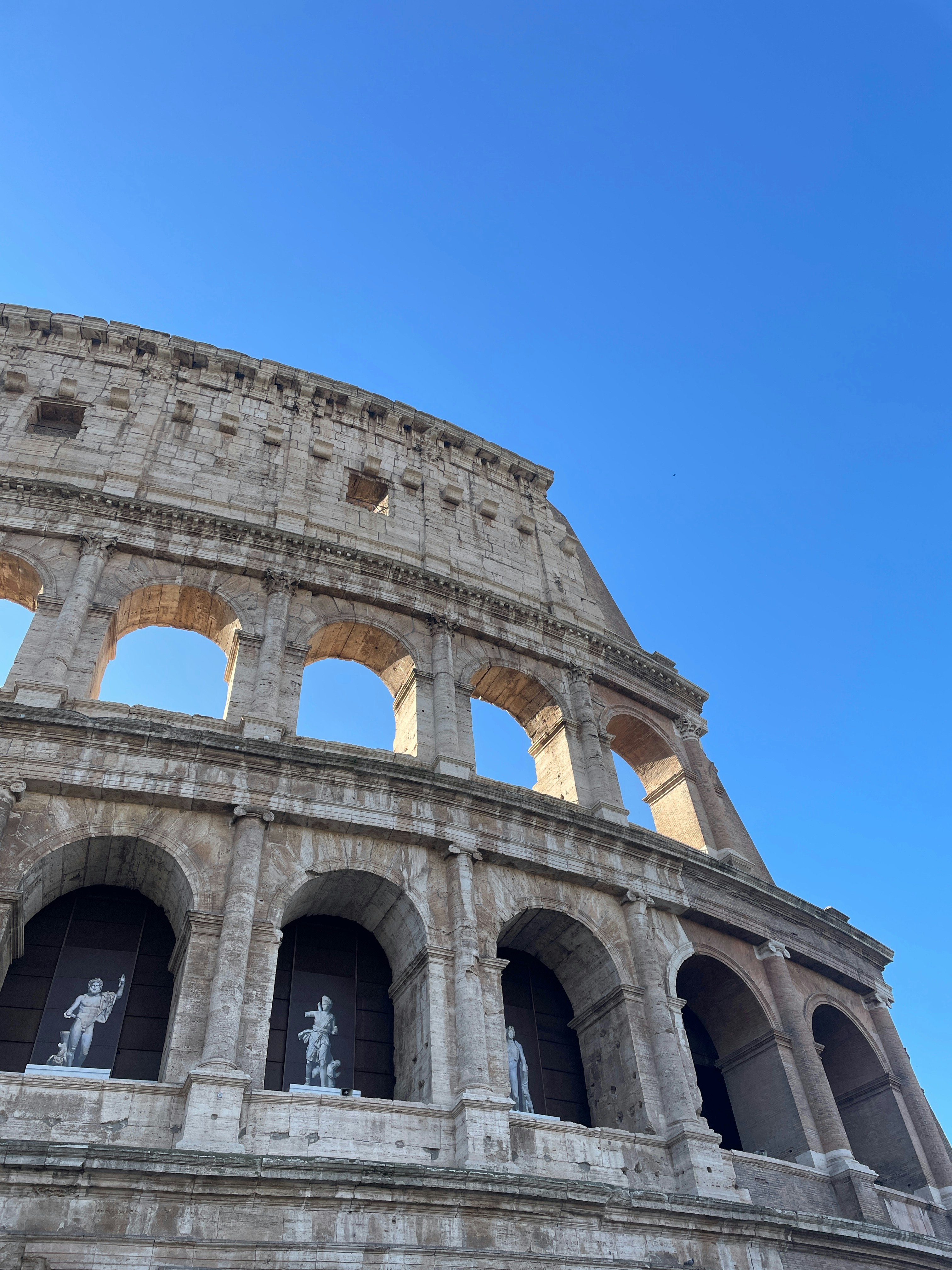 A large stone building with a sky background photo – Free Colosseum ...