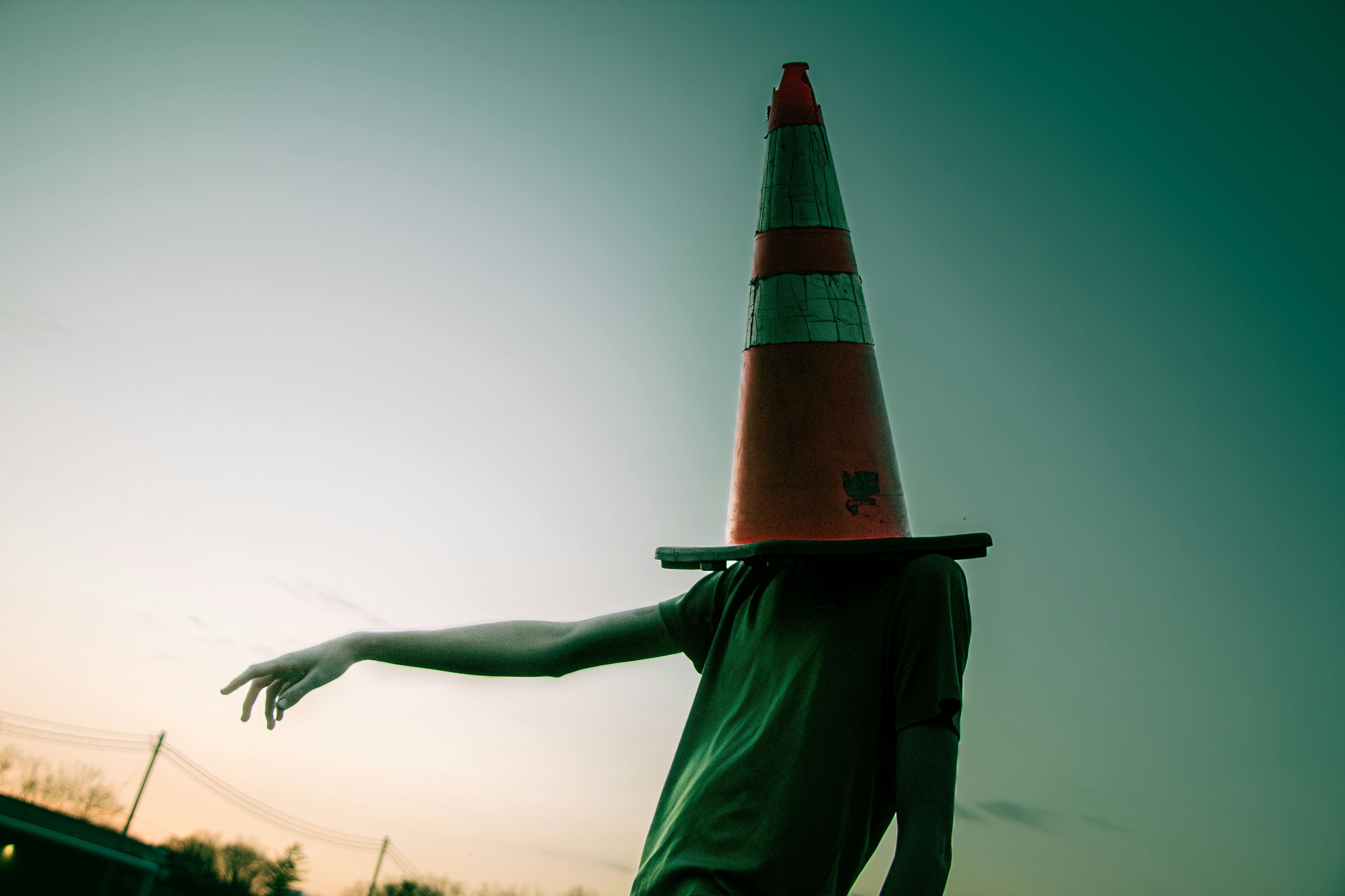 A person with a traffic cone on their head photo – Free Person Image on ...