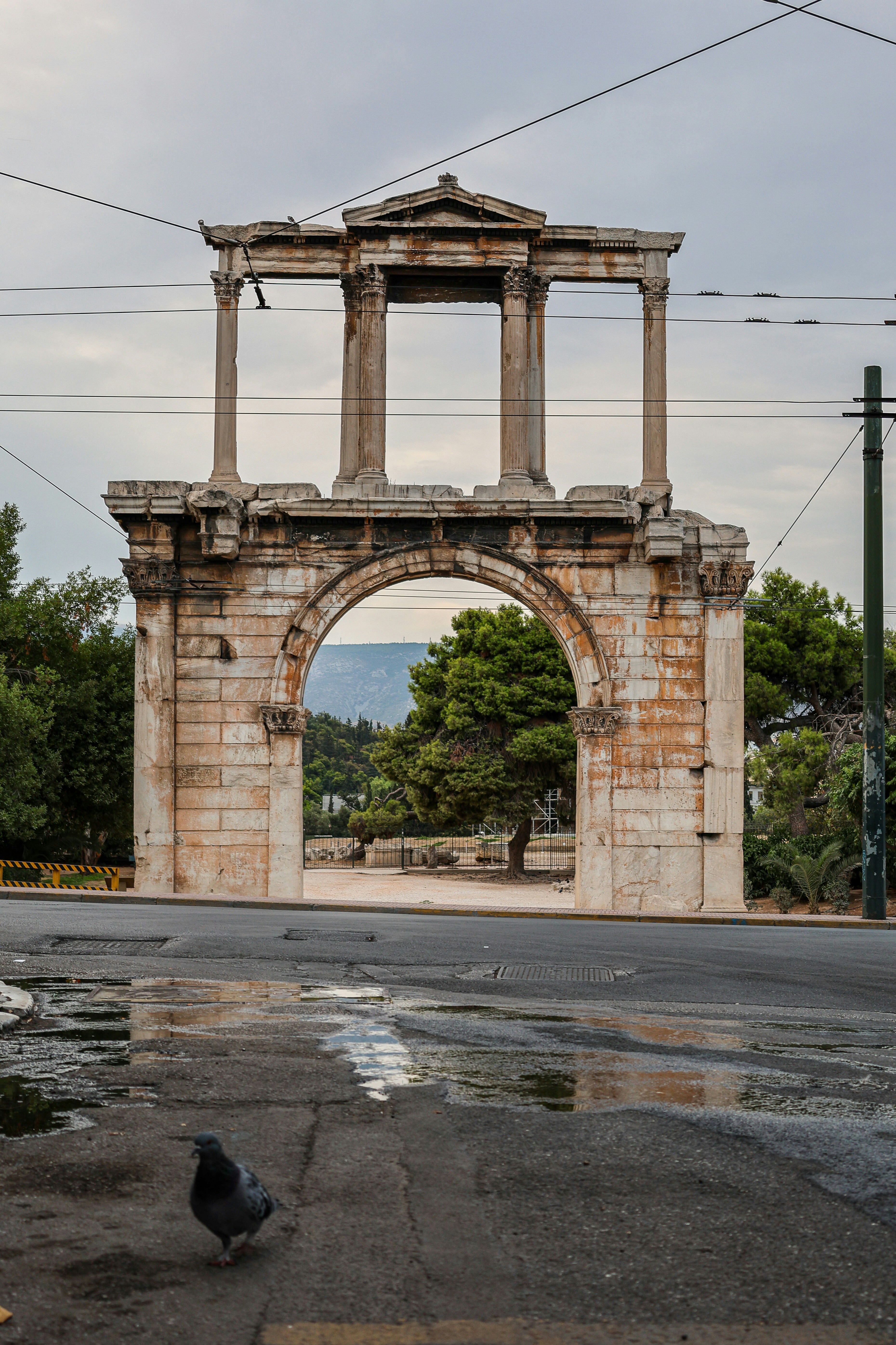 Time-Worn Arch at the City Threshold, Pigeon in the Foreground
