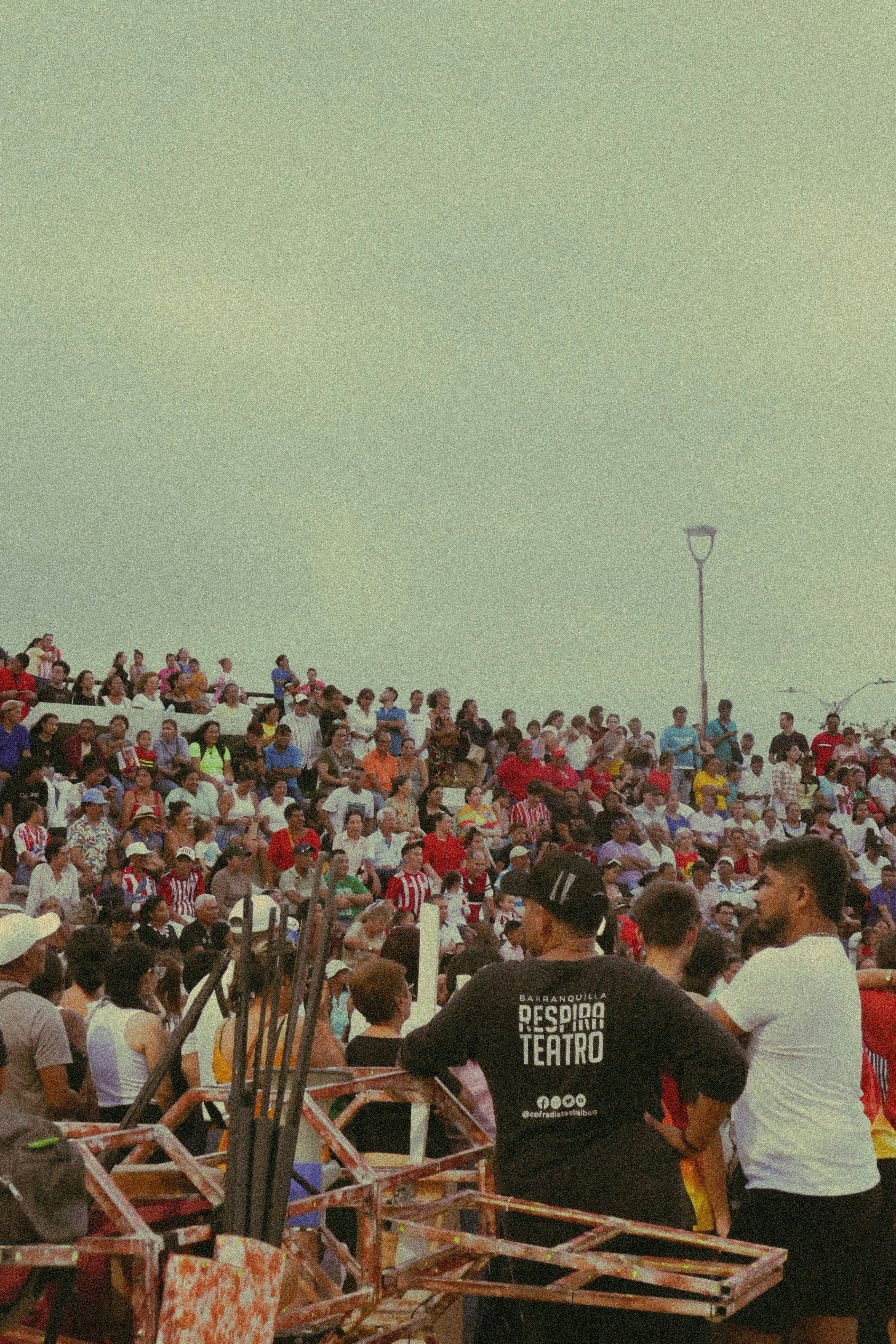 A large crowd of people sitting in a stadium photo – Free Human Image ...