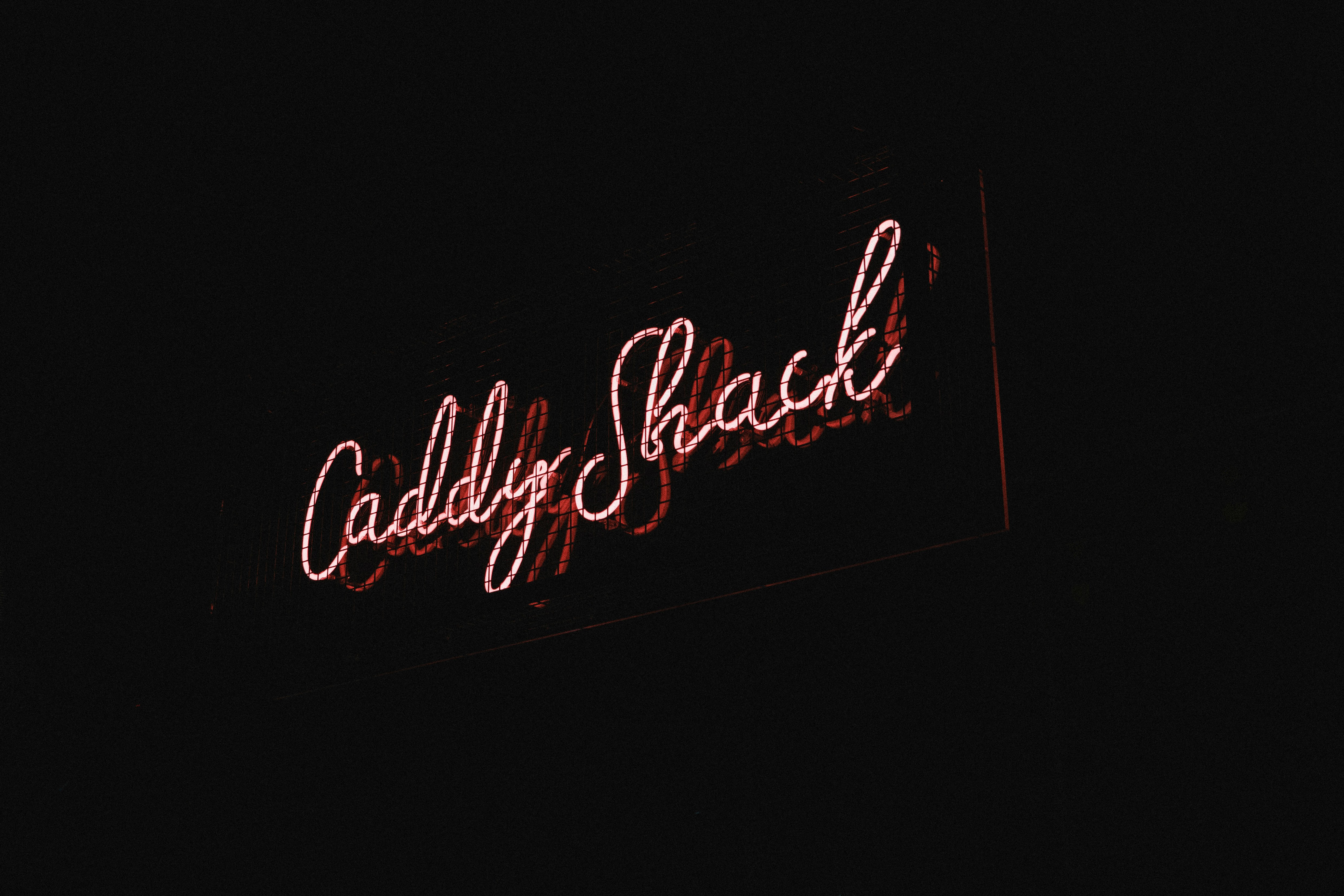 A red neon sign that reads caddy shack photo – Free Neon light Image on ...