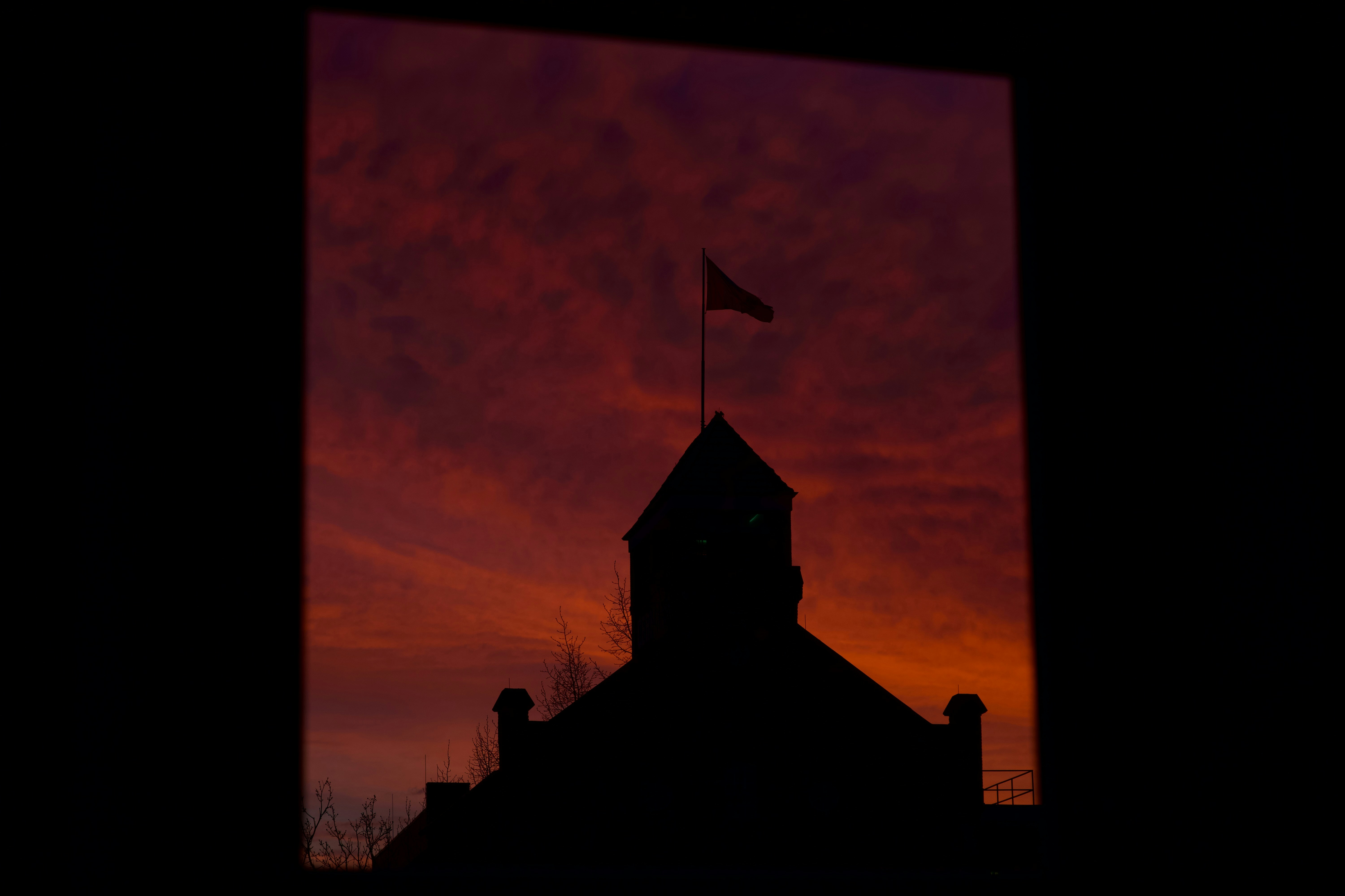 Ember Sky Over a Flag-Topped Fortress