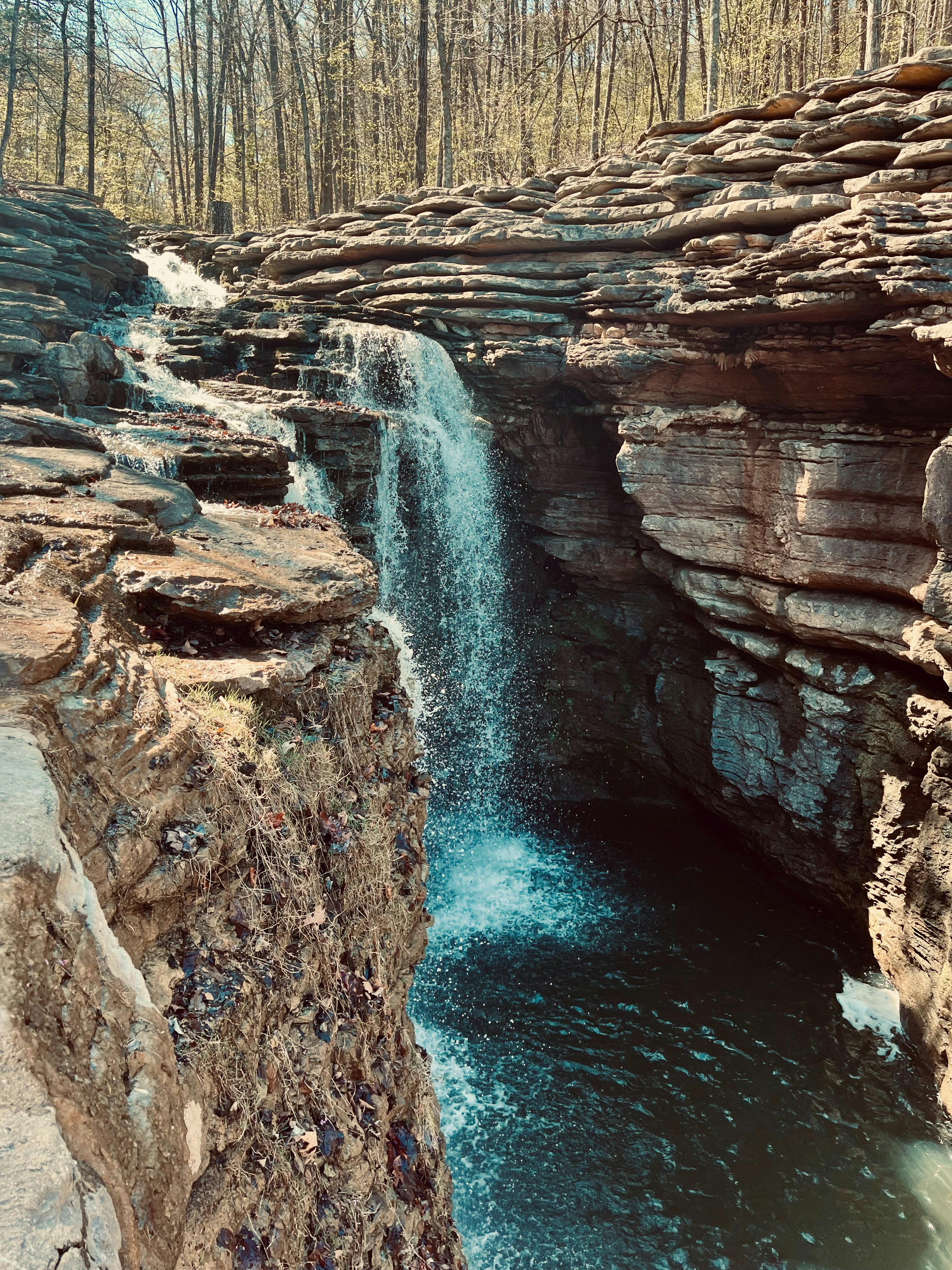 A small waterfall in the middle of a canyon photo – Free Top of the ...