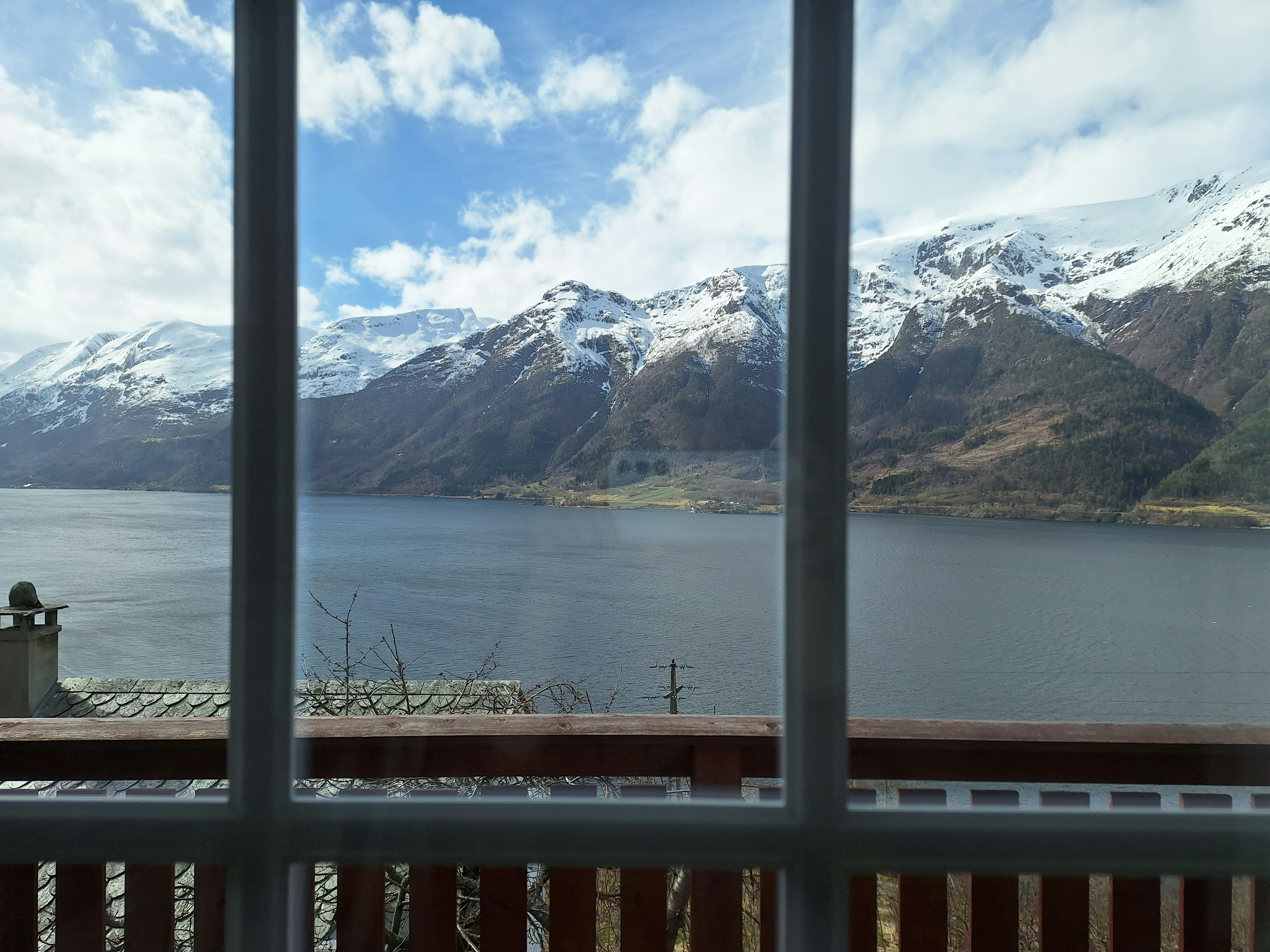 A view of a lake through a window photo – Free Norway Image on Unsplash
