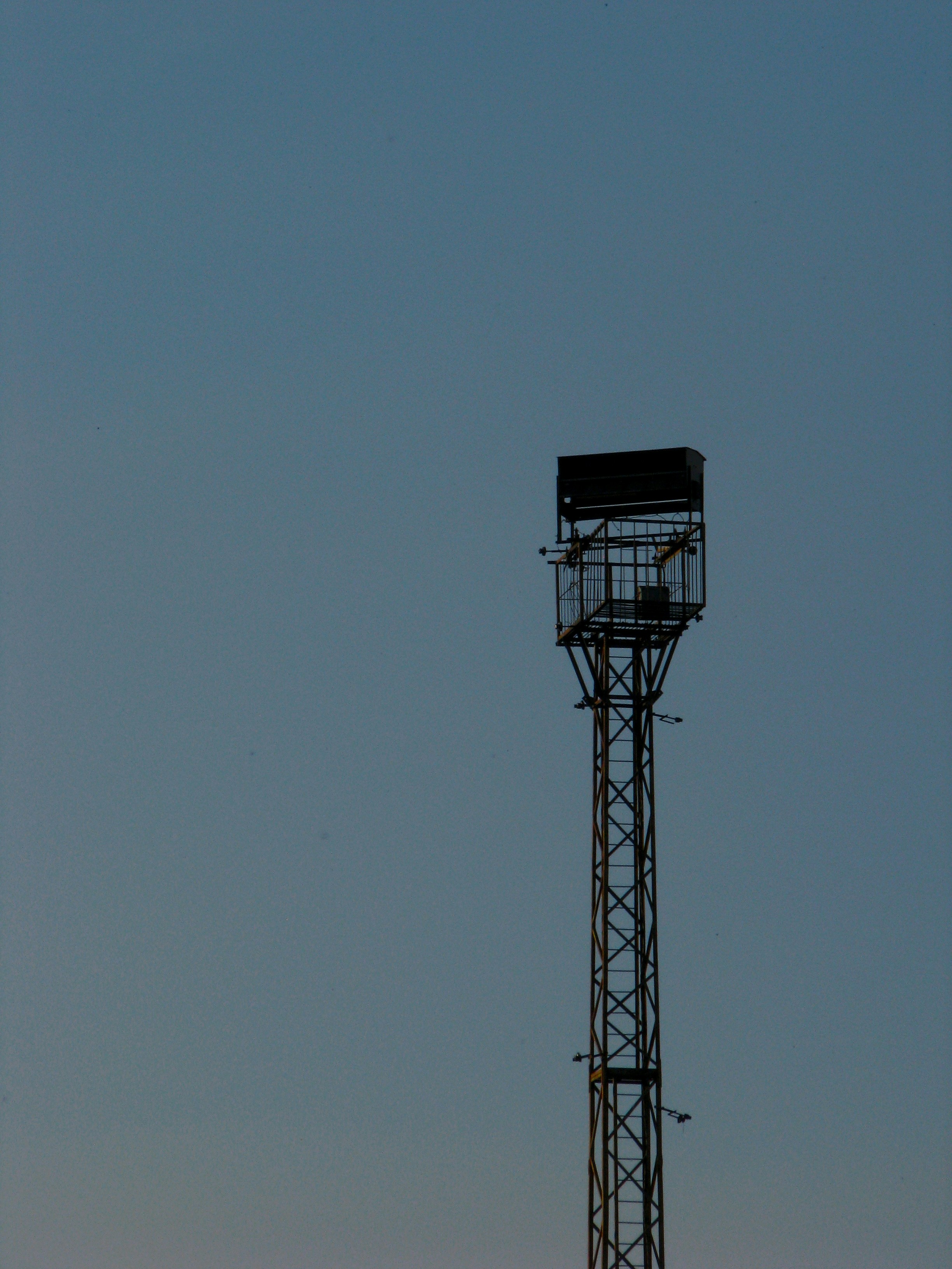a tall tower with a clock on the top of it