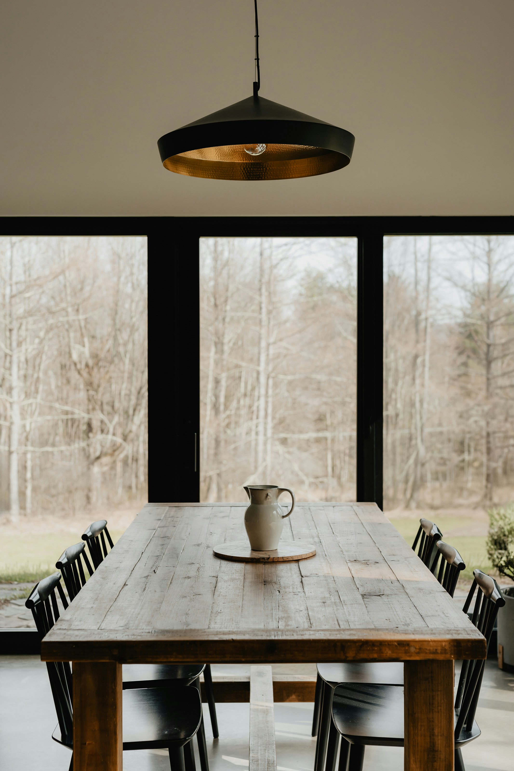 Winter Quiet at the Table: A Centered Pitcher on a Weathered Long Table