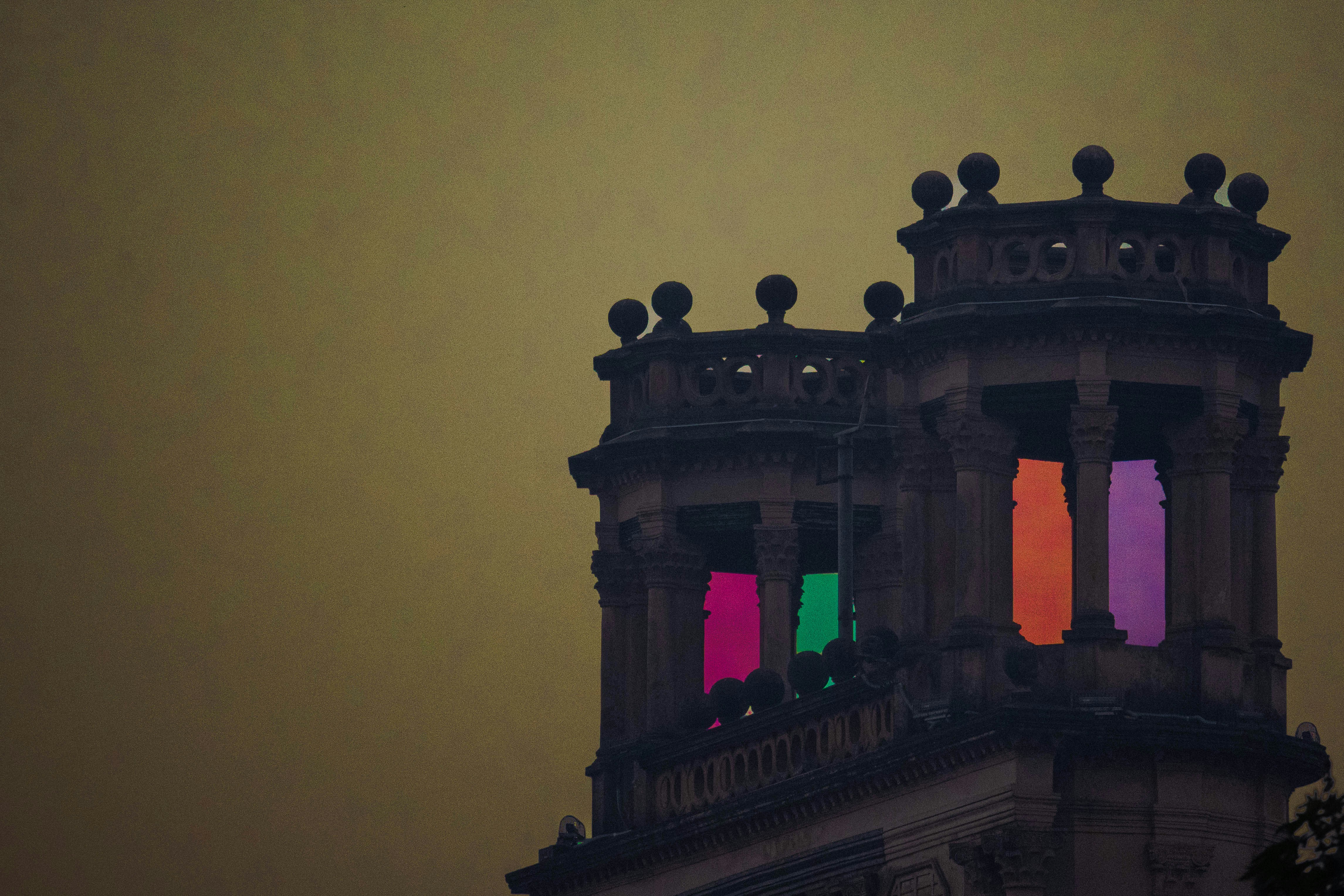 Subdued Bell-Tower Silhouette with Neon Inserts