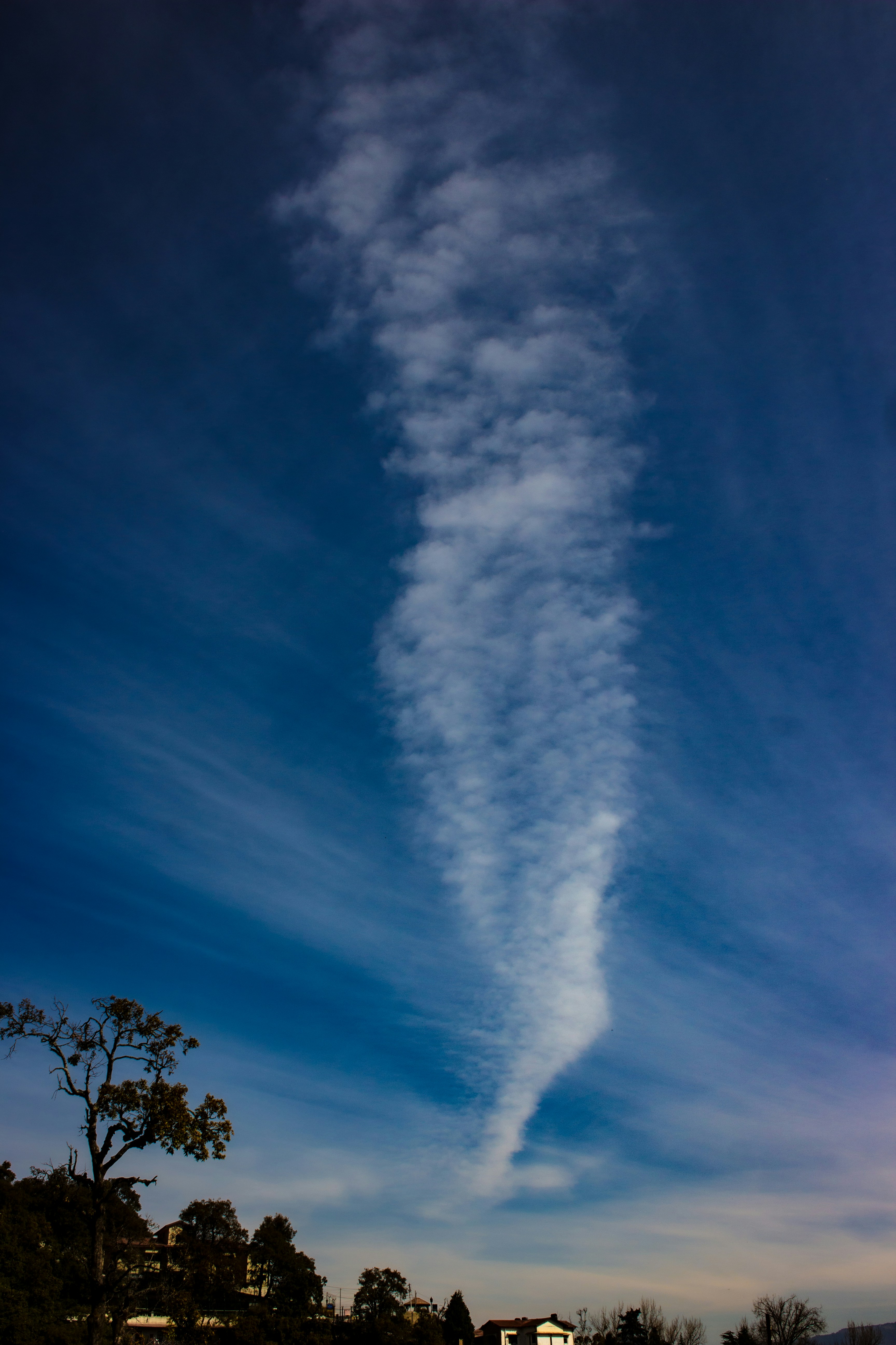 A very long cloud in the sky above a field photo – Free Dehradun Image ...