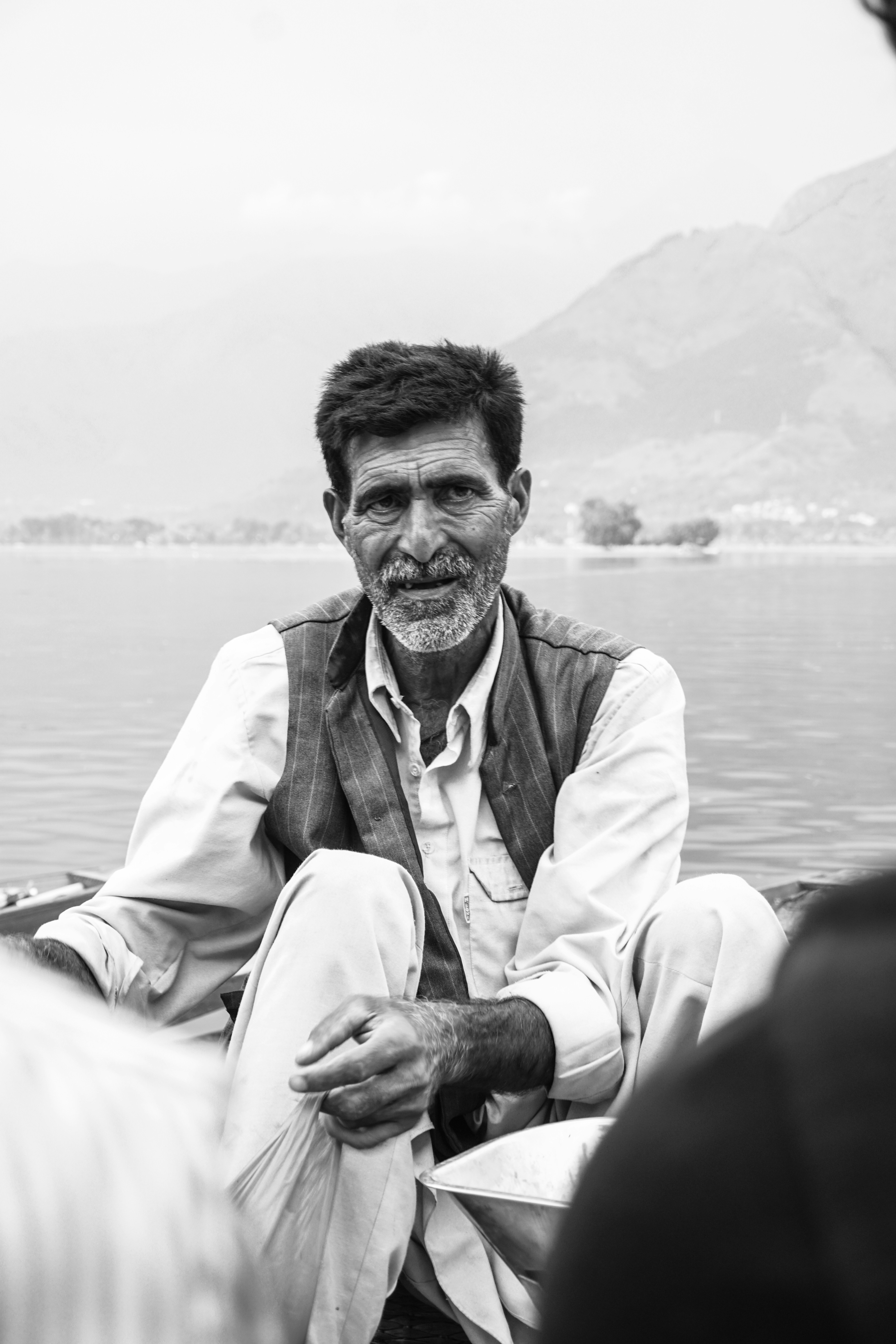 Weathered Fisherman in a Quiet Alpine Lake