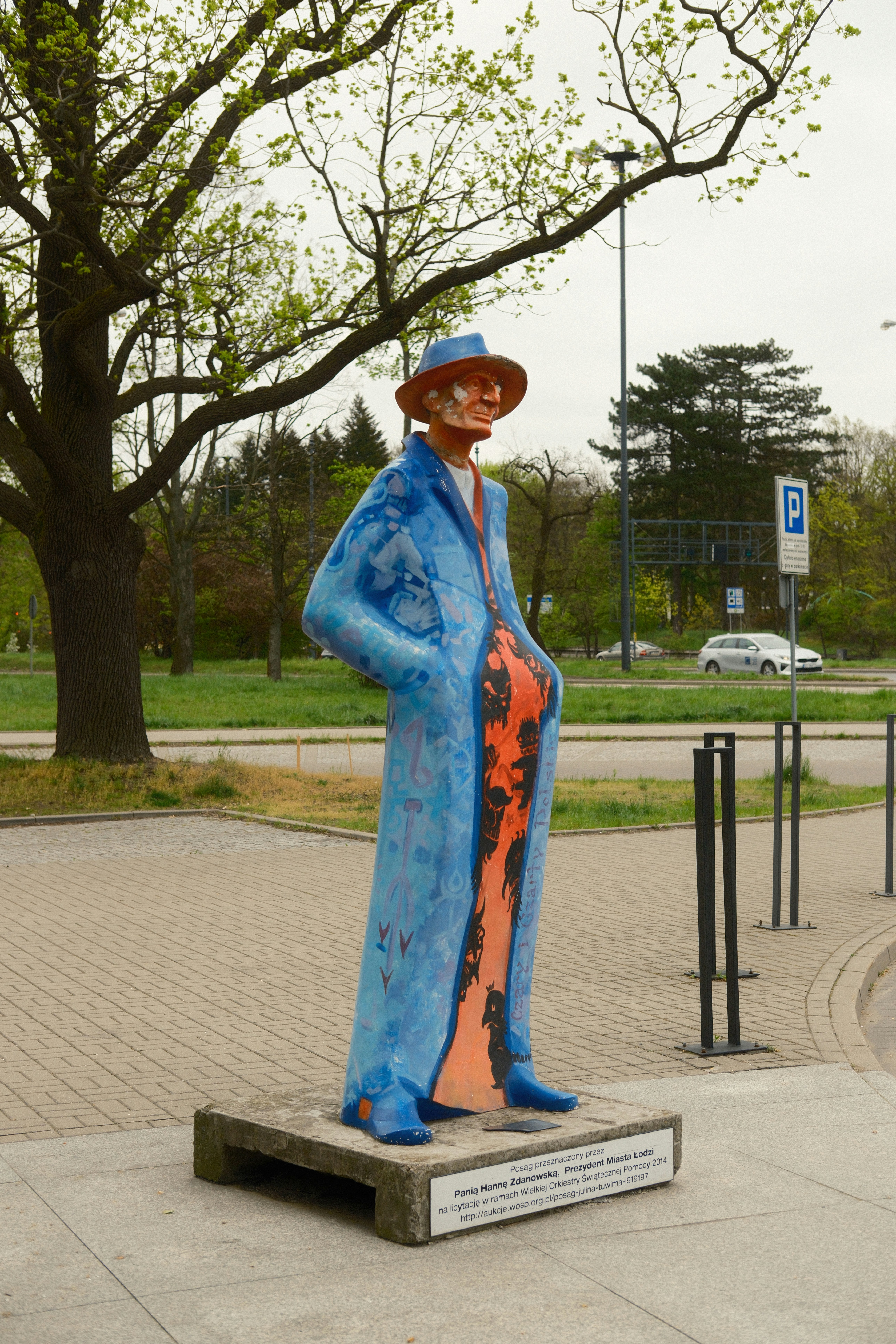 Azure Sentinel in the Park: A Painted Statue Stands Tall