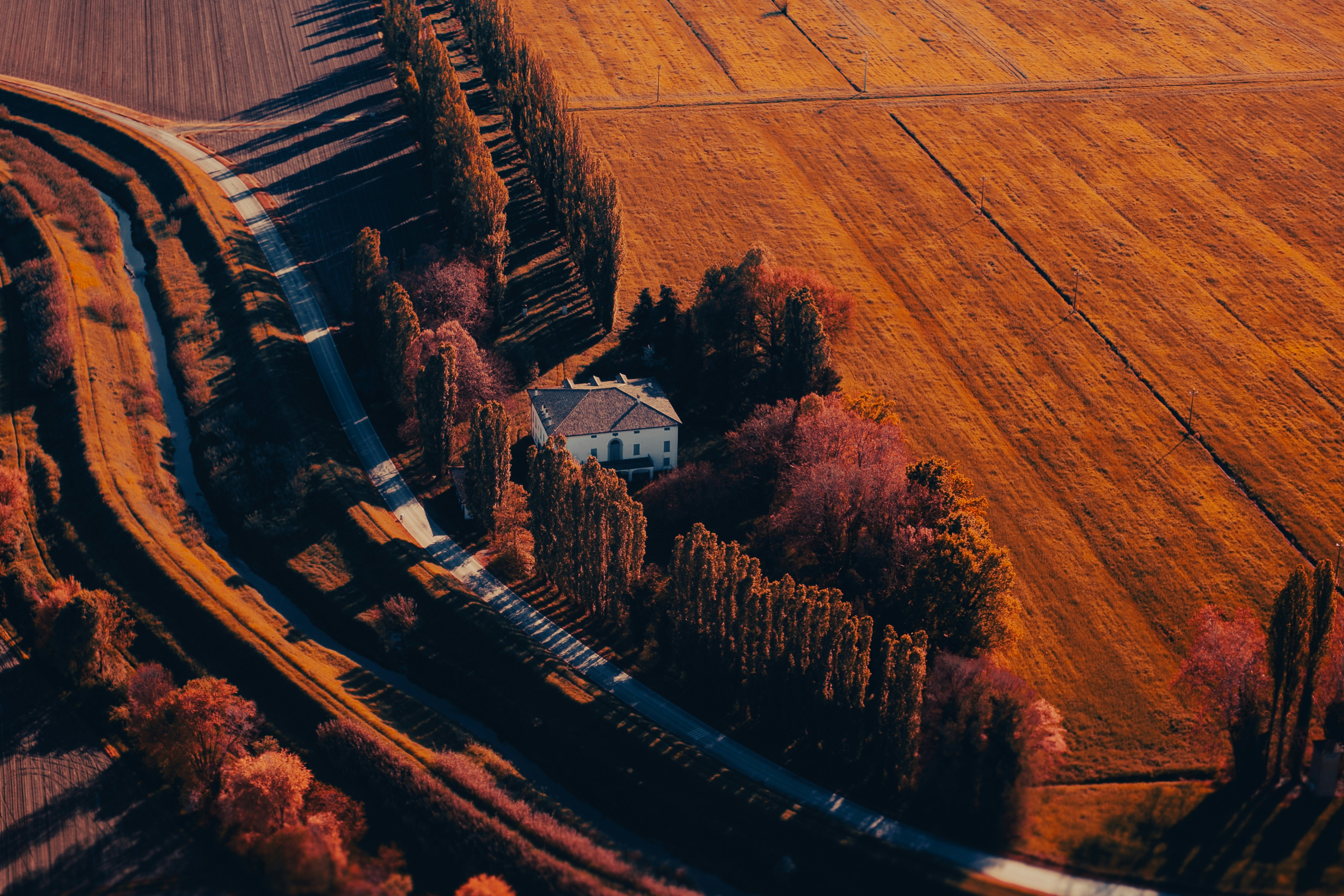 An aerial view of a farm and a train track photo – Free Building Image ...
