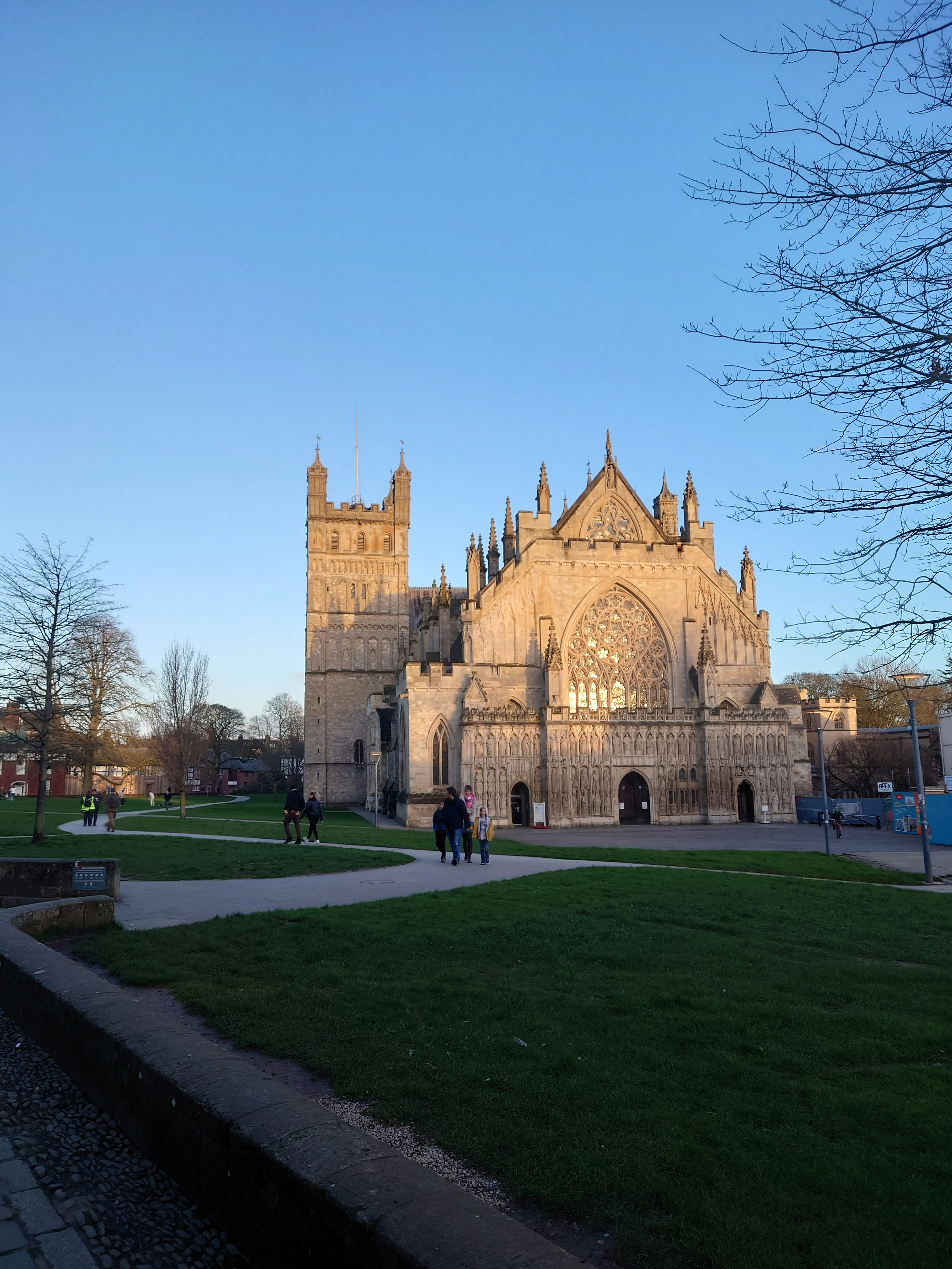 A large building with a clock tower on top of it photo – Free Exeter ...