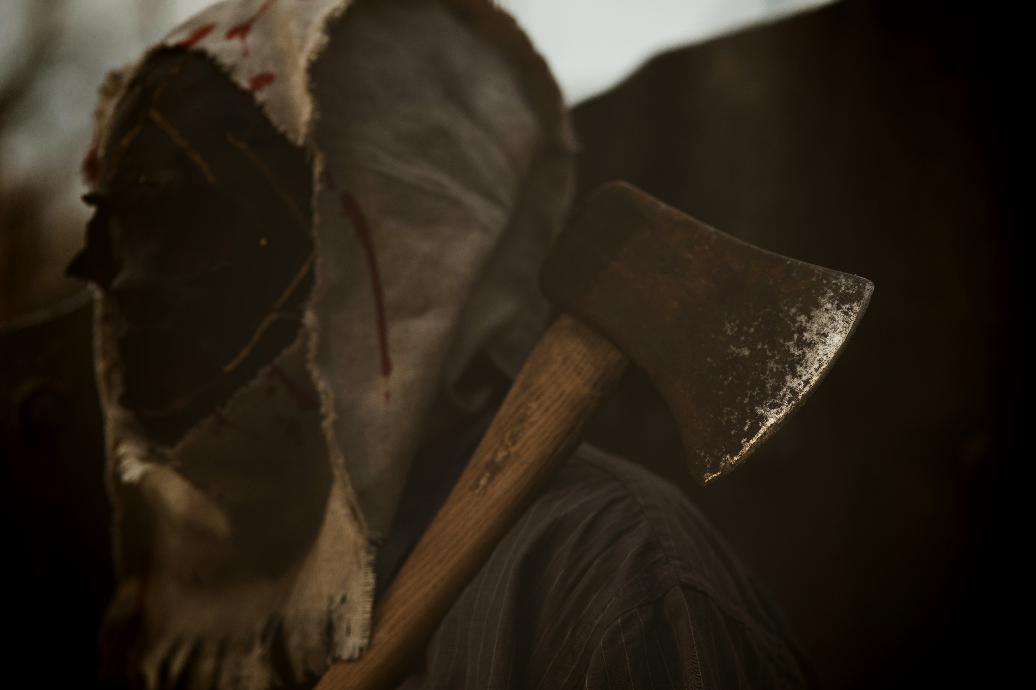 A close up of a bloody mask with an axe photo – Free Axe Image on Unsplash