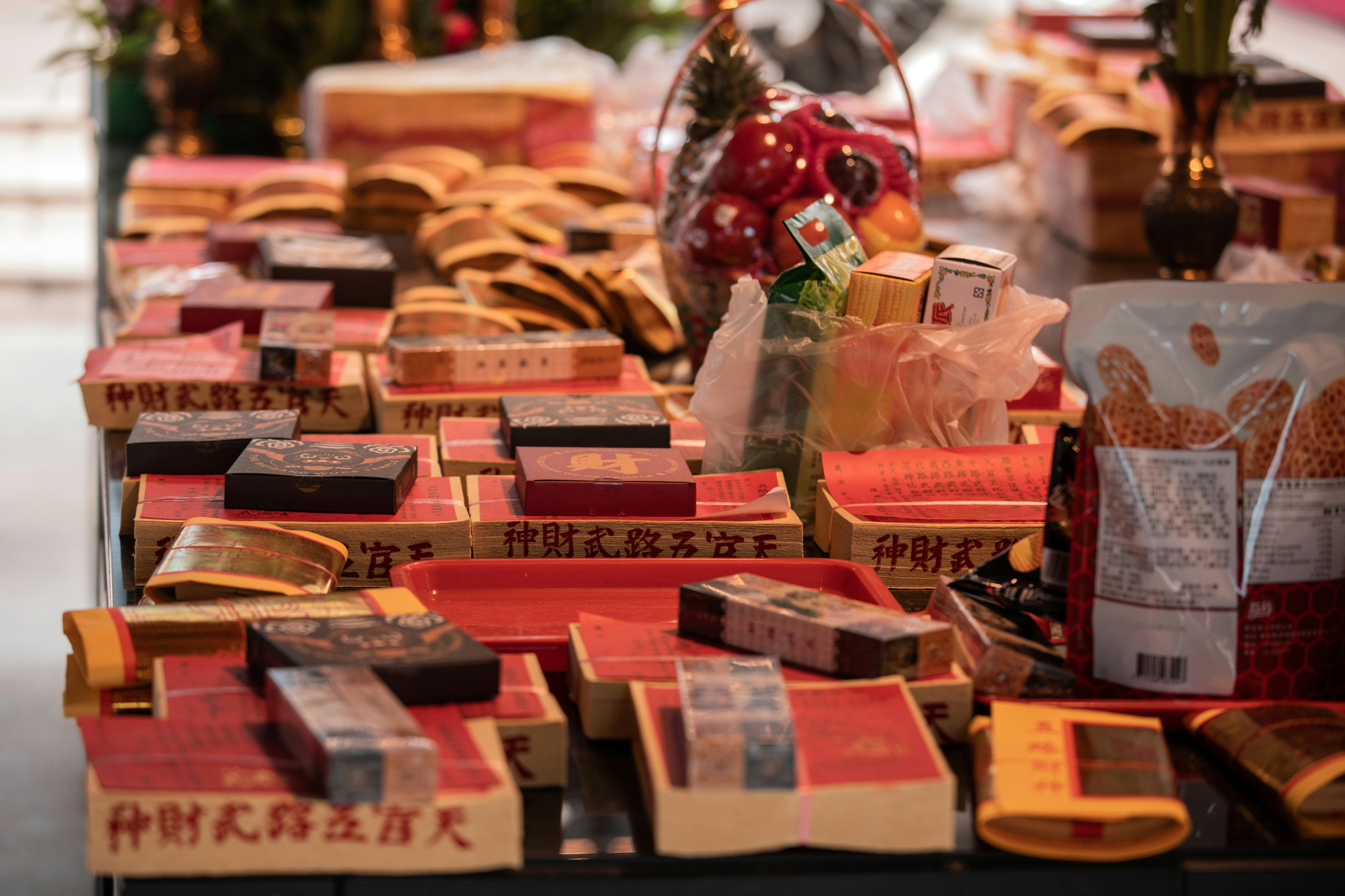 Rows of Red-Label Chinese Tea Boxes on a Market Stall