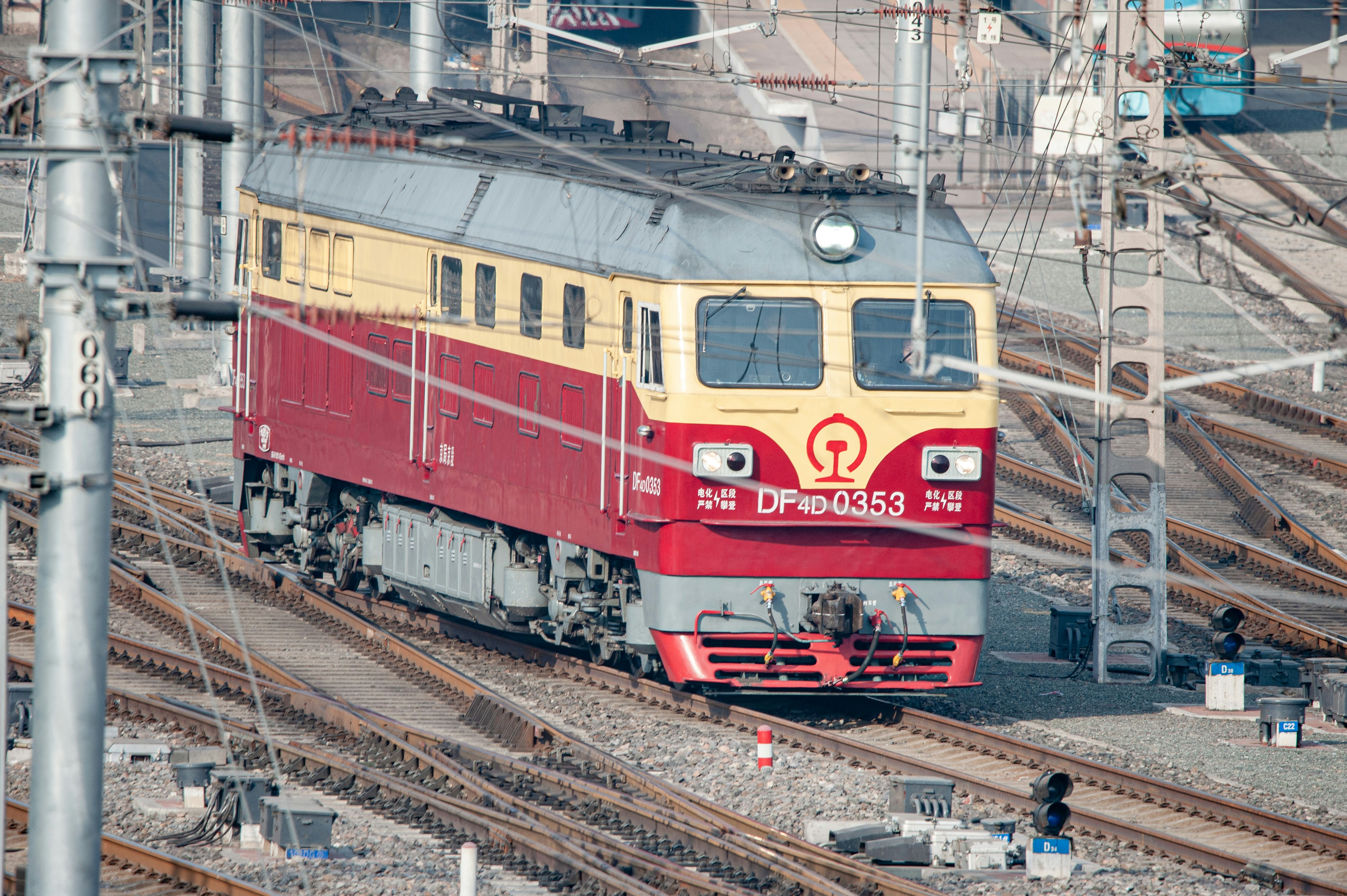 A red and yellow train traveling down train tracks photo – Free Train ...