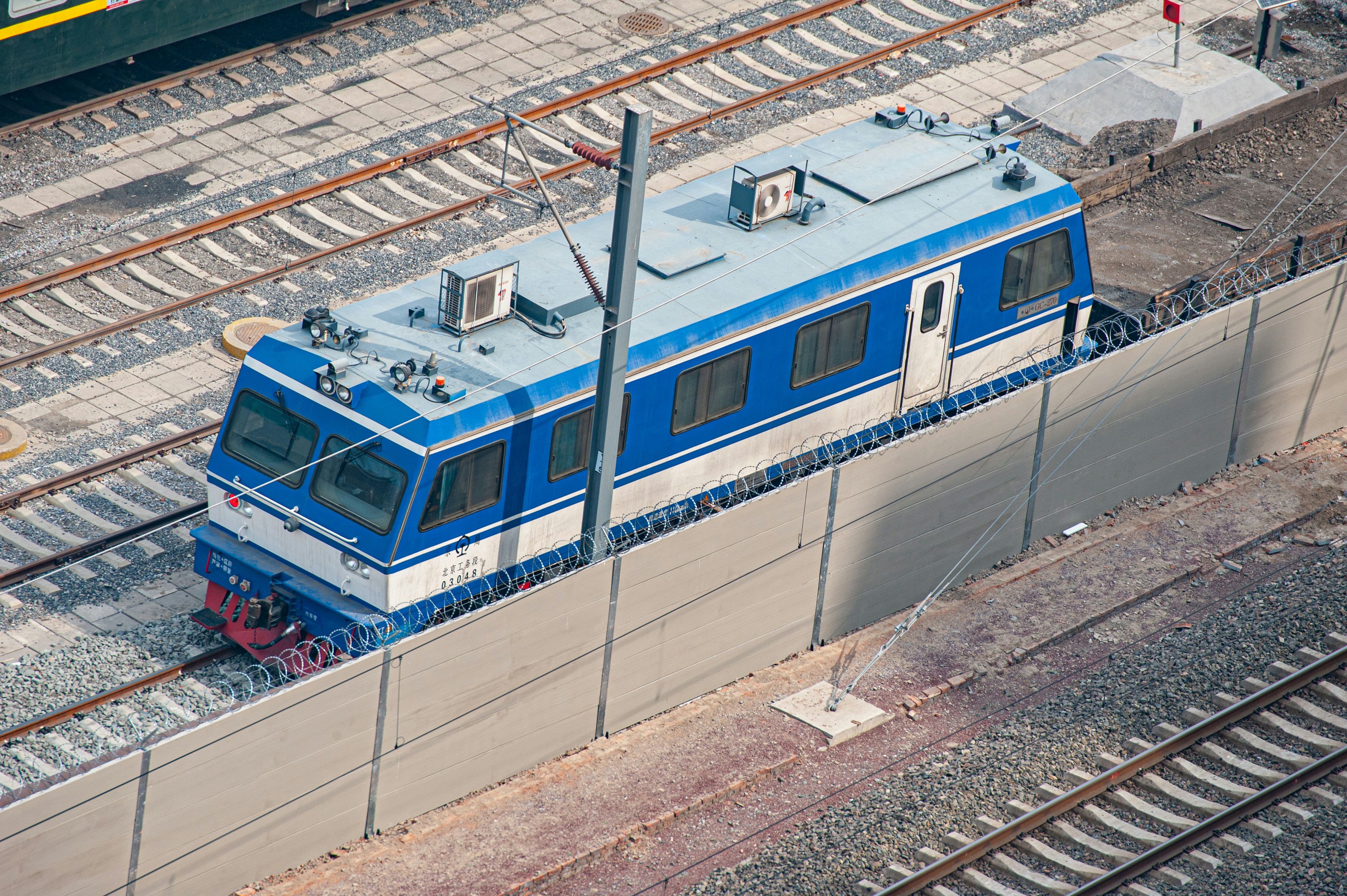 Blue Locomotive on the Elevated Tracks