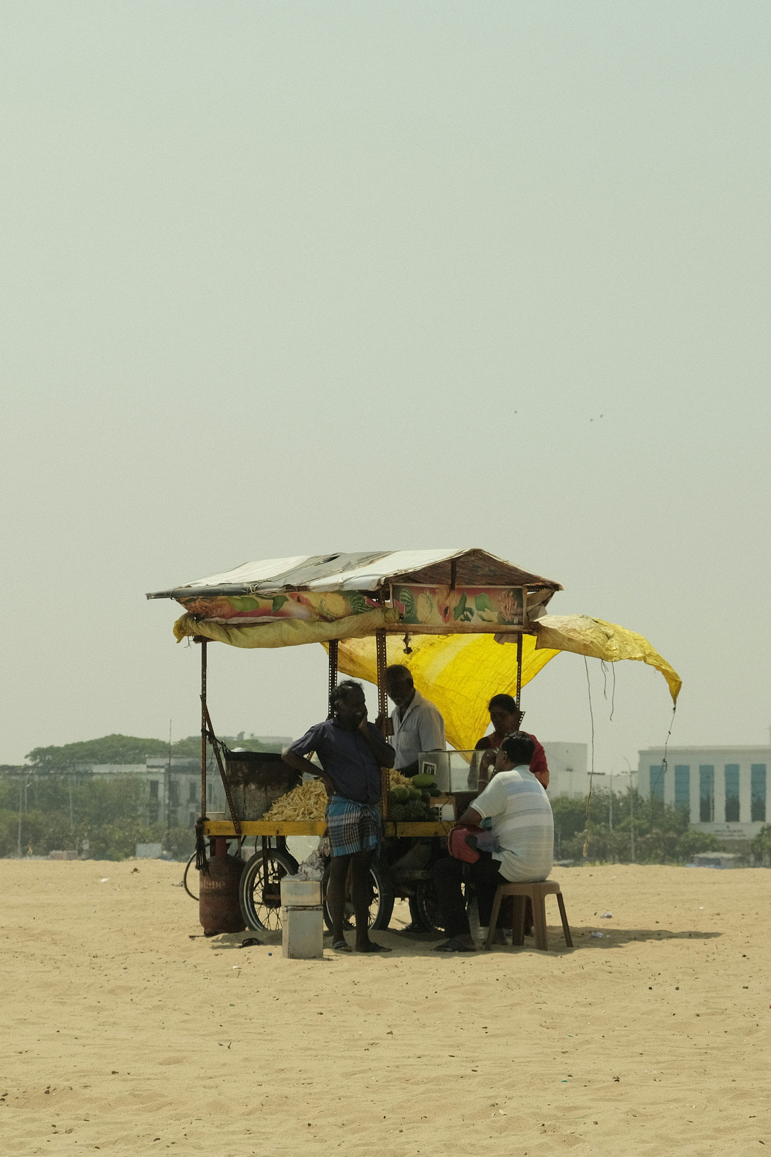 Beachfront Snack Cart Under a Sunlit Yellow Canopy
