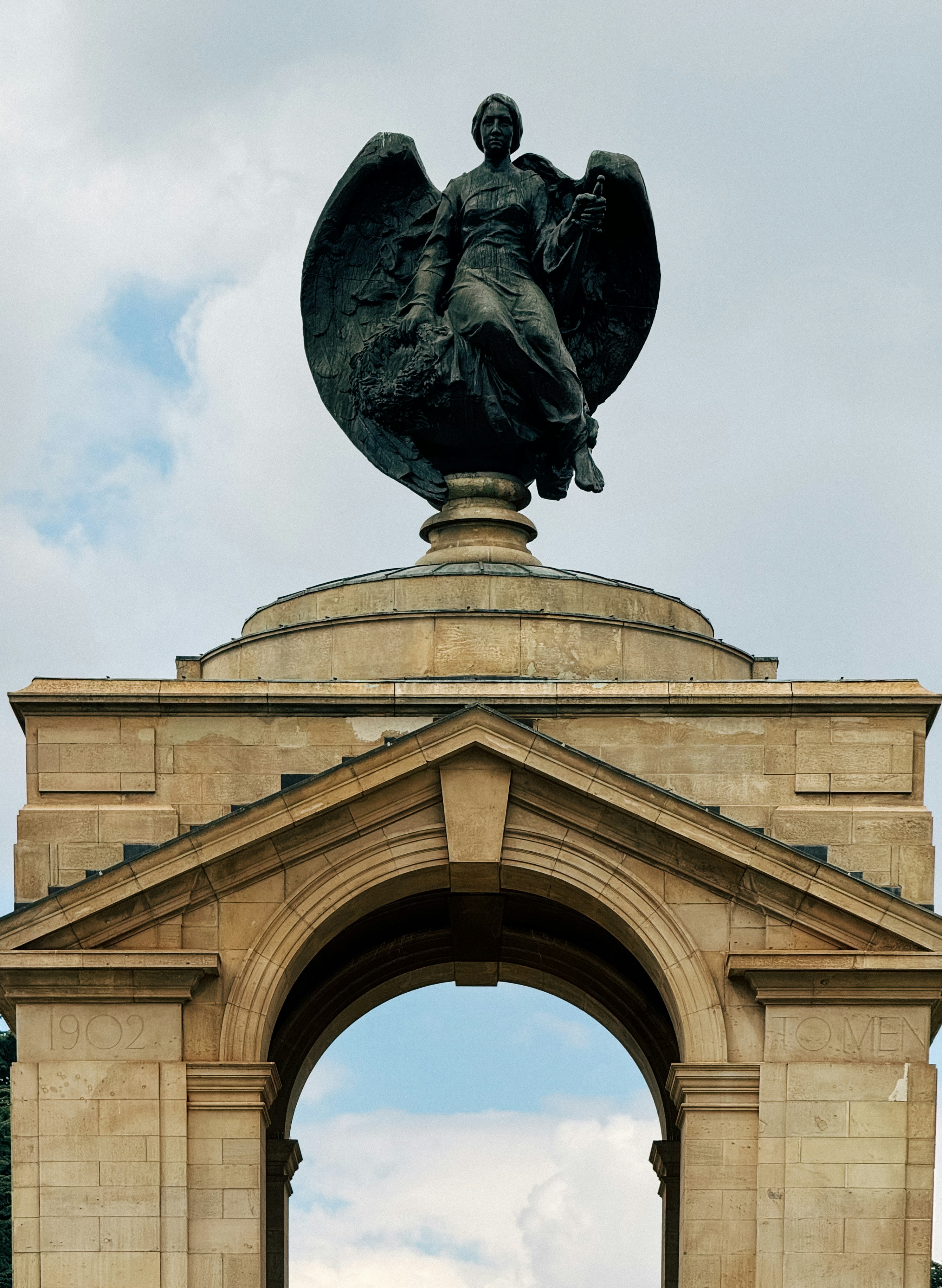 Winged Guardian Overlook: The Monumental Arch with Angel Statue