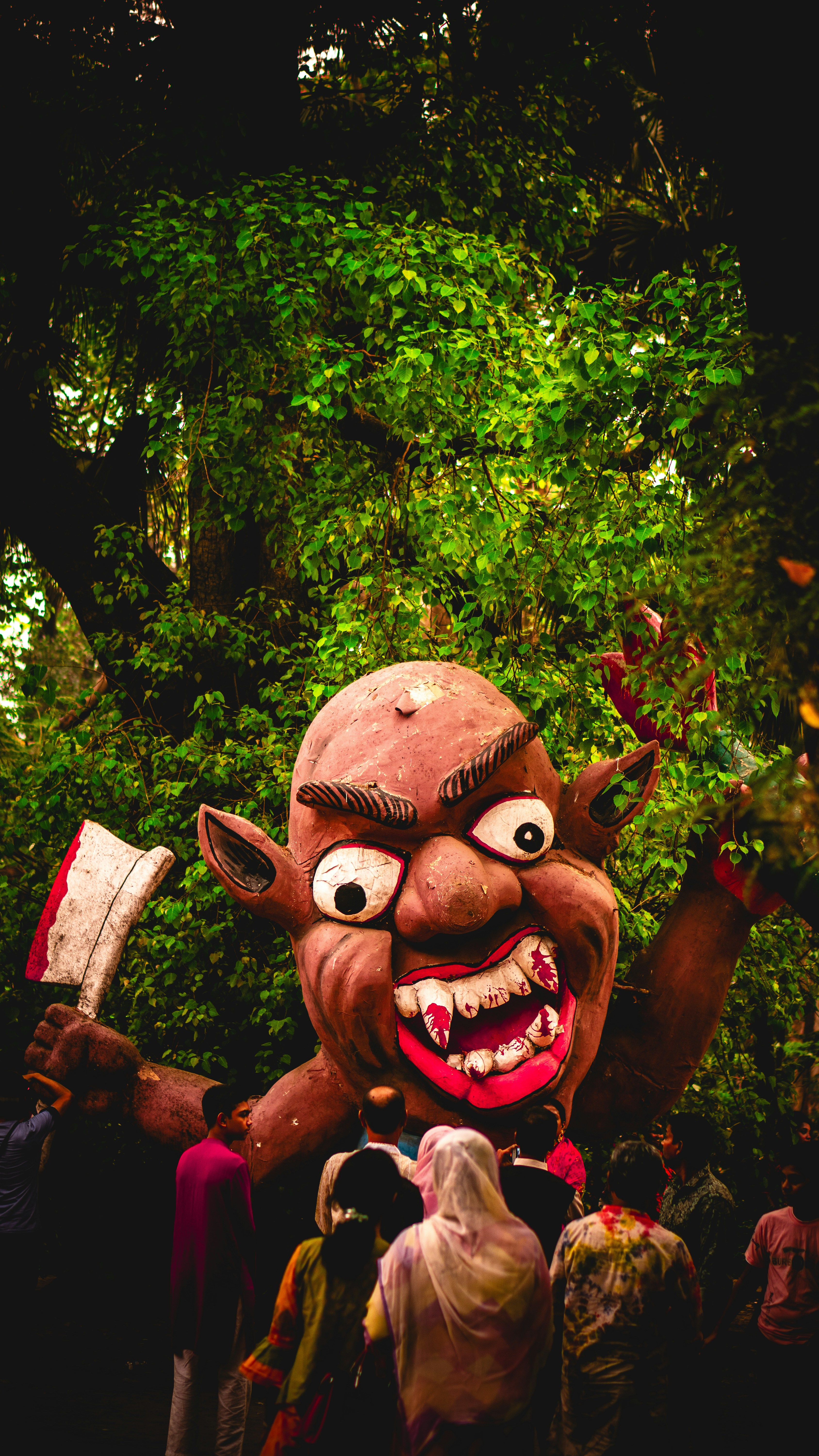 Grinning Troll in the Crowd: A Nighttime Festival Encounter