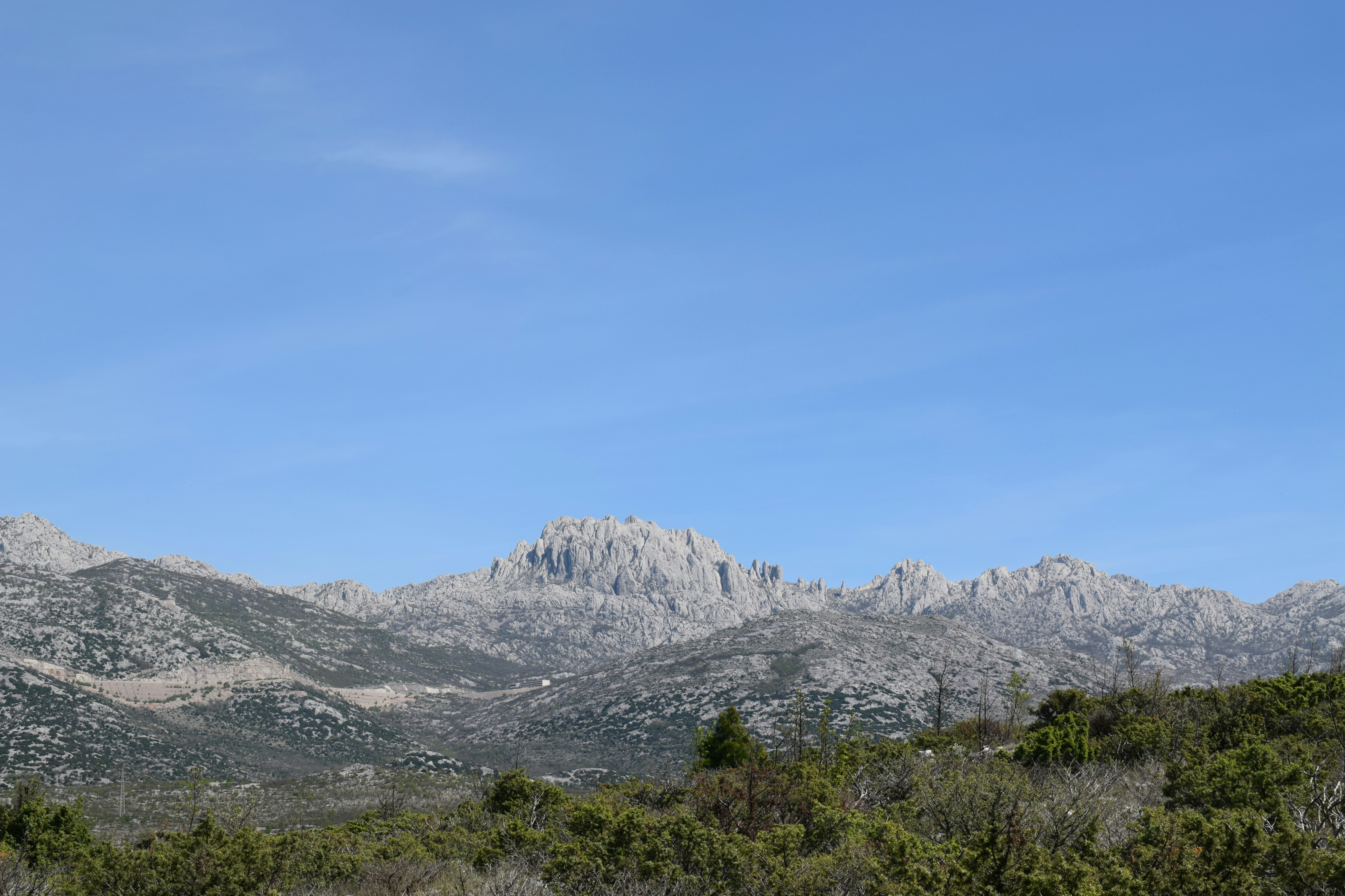 Jagged Granite Ridge Beneath a Pristine Blue Sky