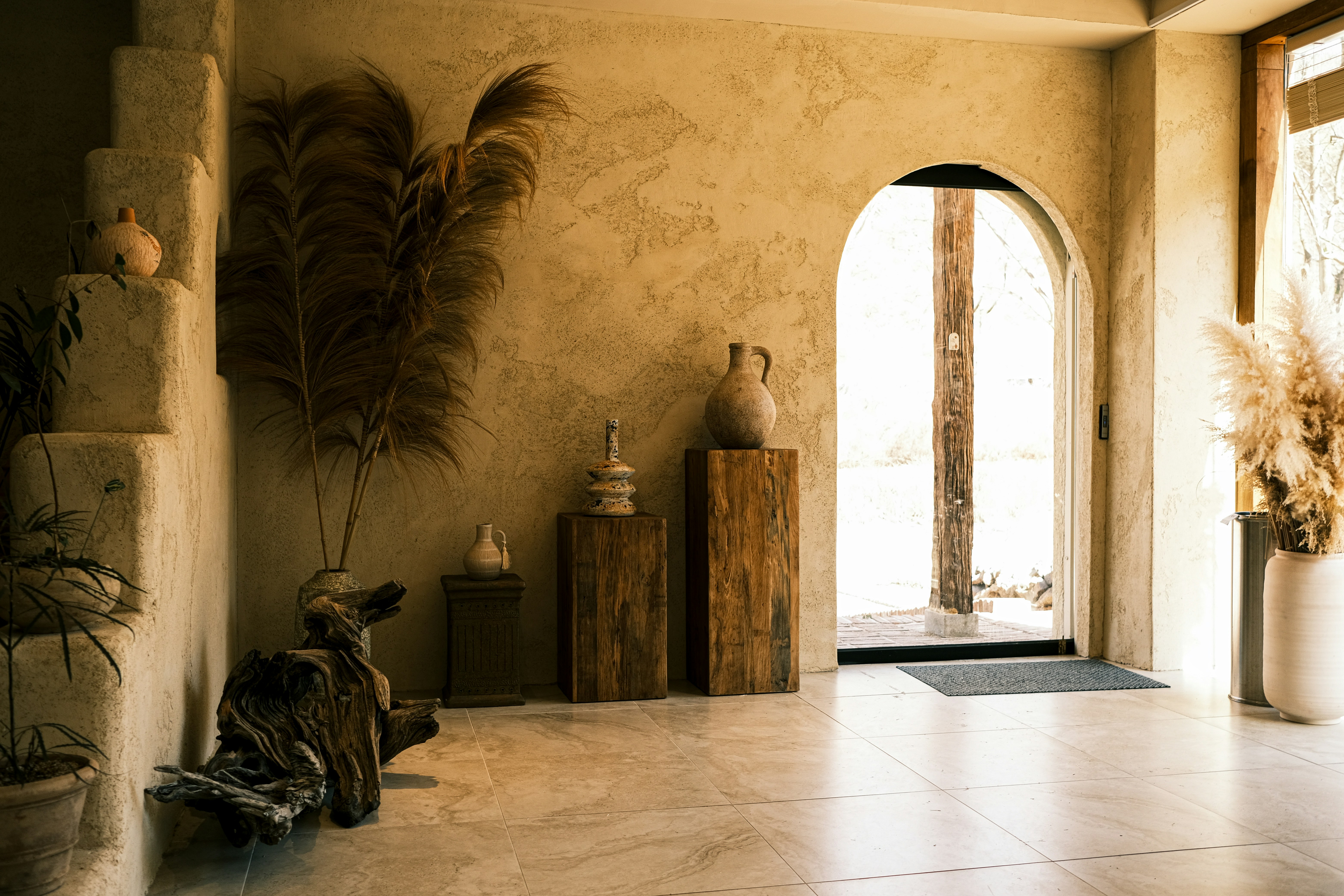 Soft Dawn in the Atrium: Ceramic Vessels and Archway