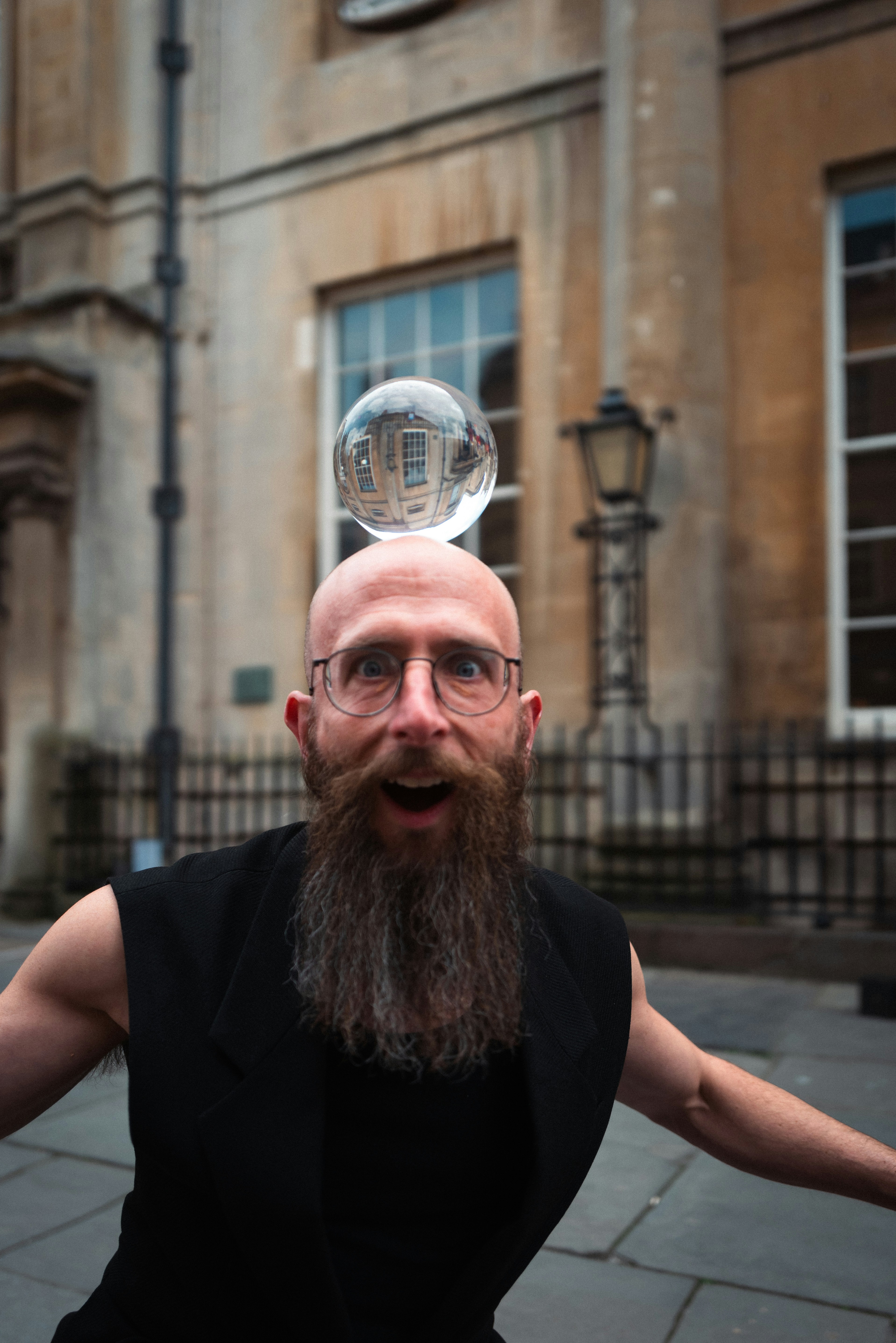 A man with a bubble on top of his head photo – Free Street performer ...
