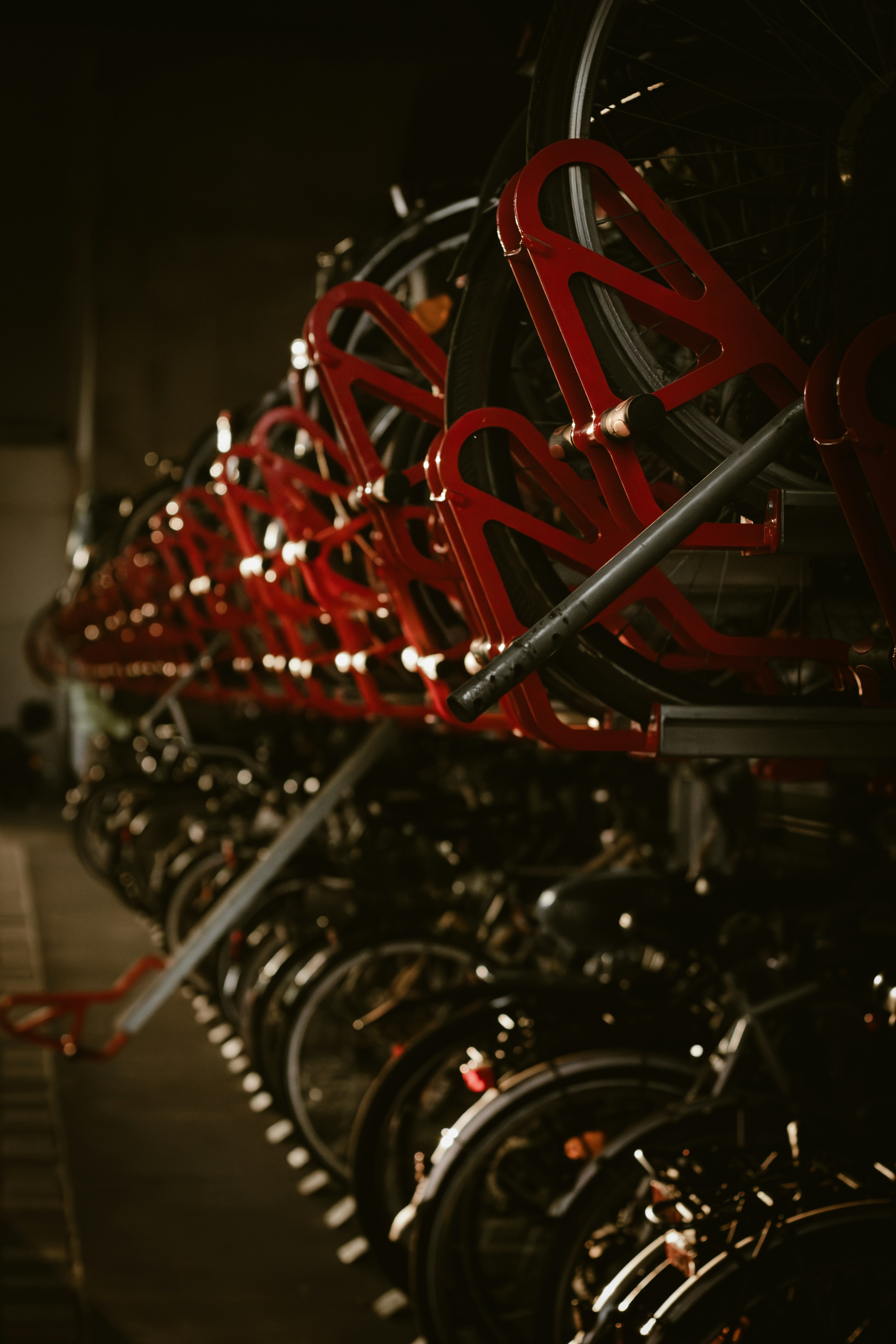 Crimson Arcs: Repetition and Rhythm in a Dim Bicycle Rack