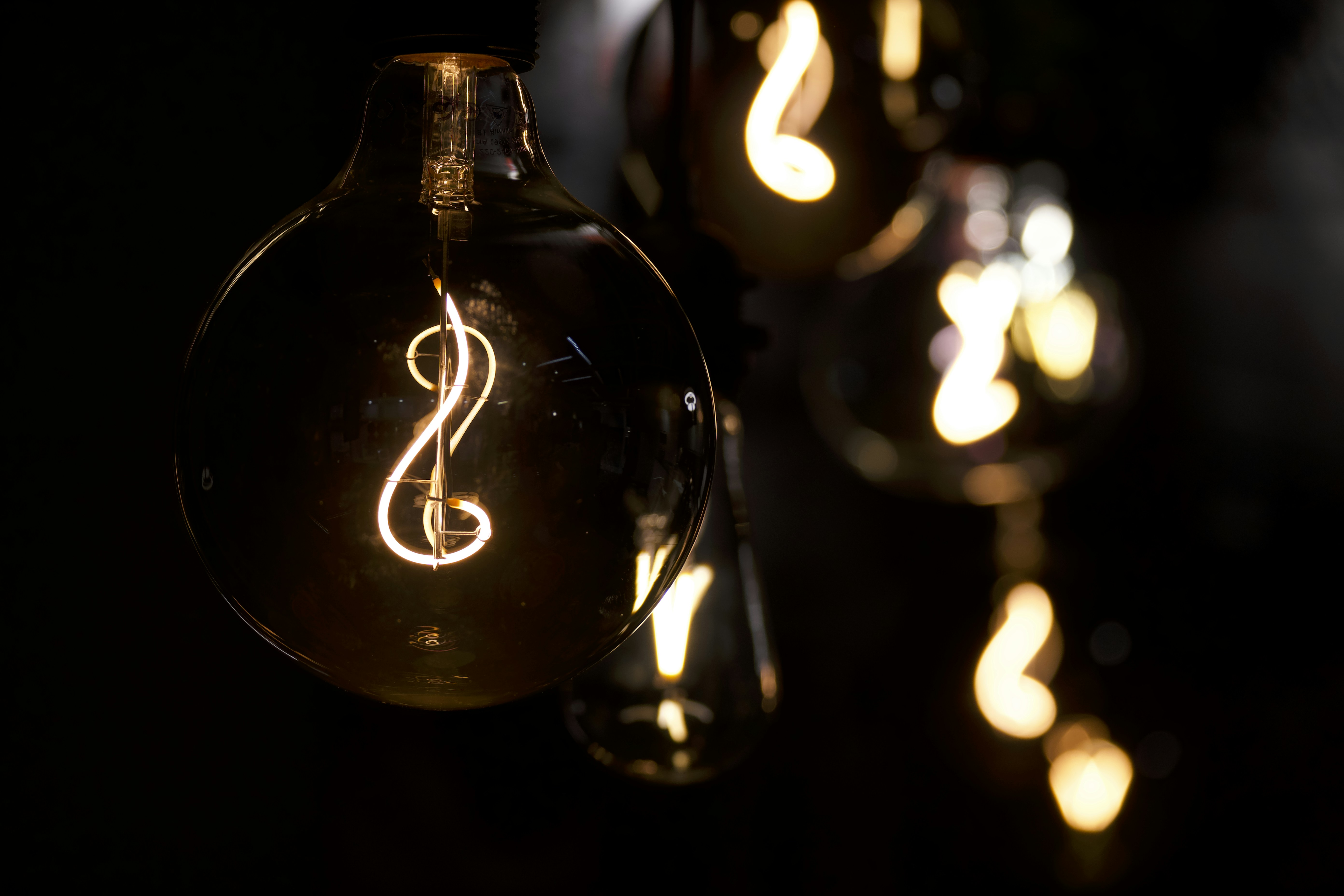 Glowing filament portraits: a cluster of warm bulbs as soft focus subjects