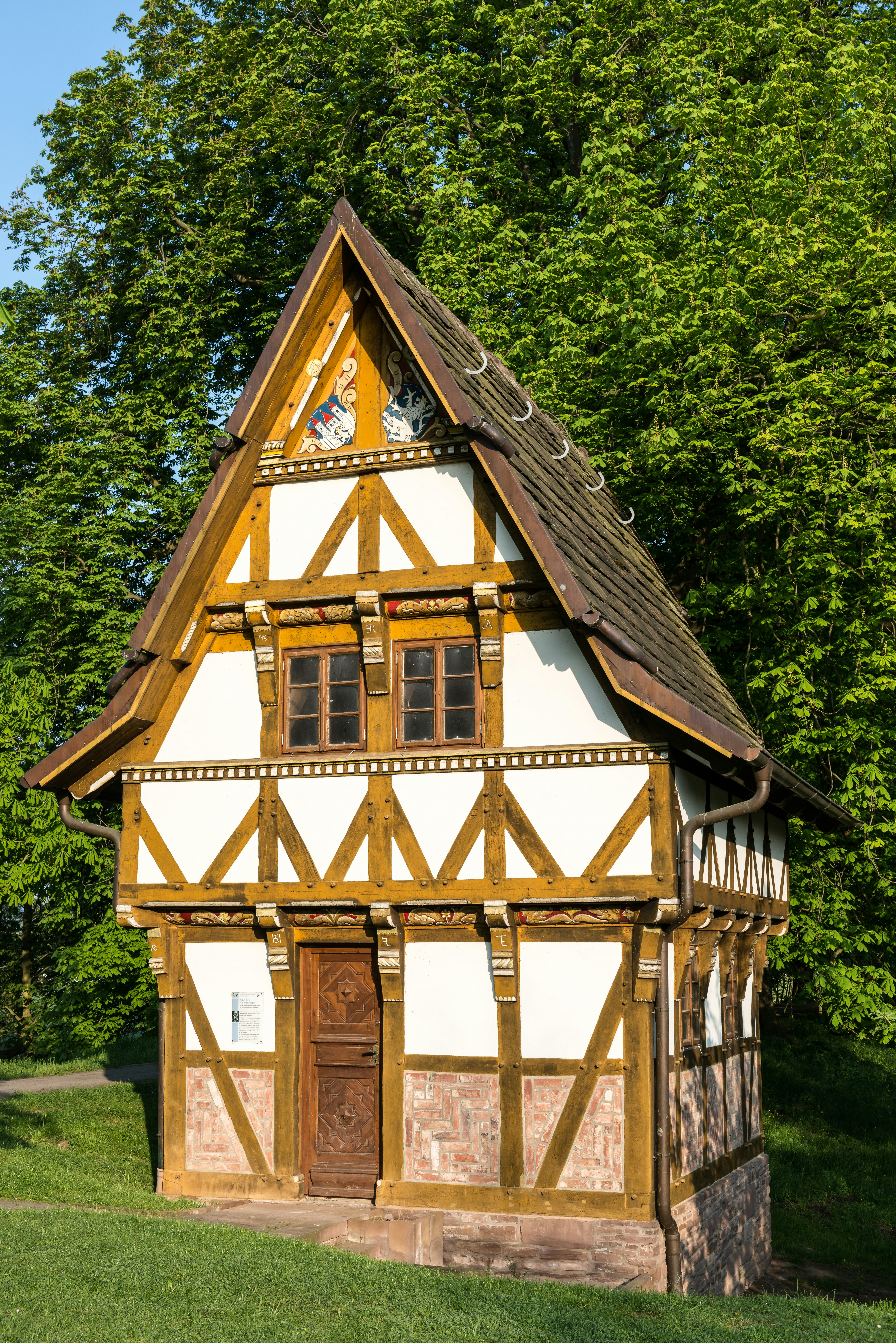 a small building with a clock on the top of itWolfgang Weiser