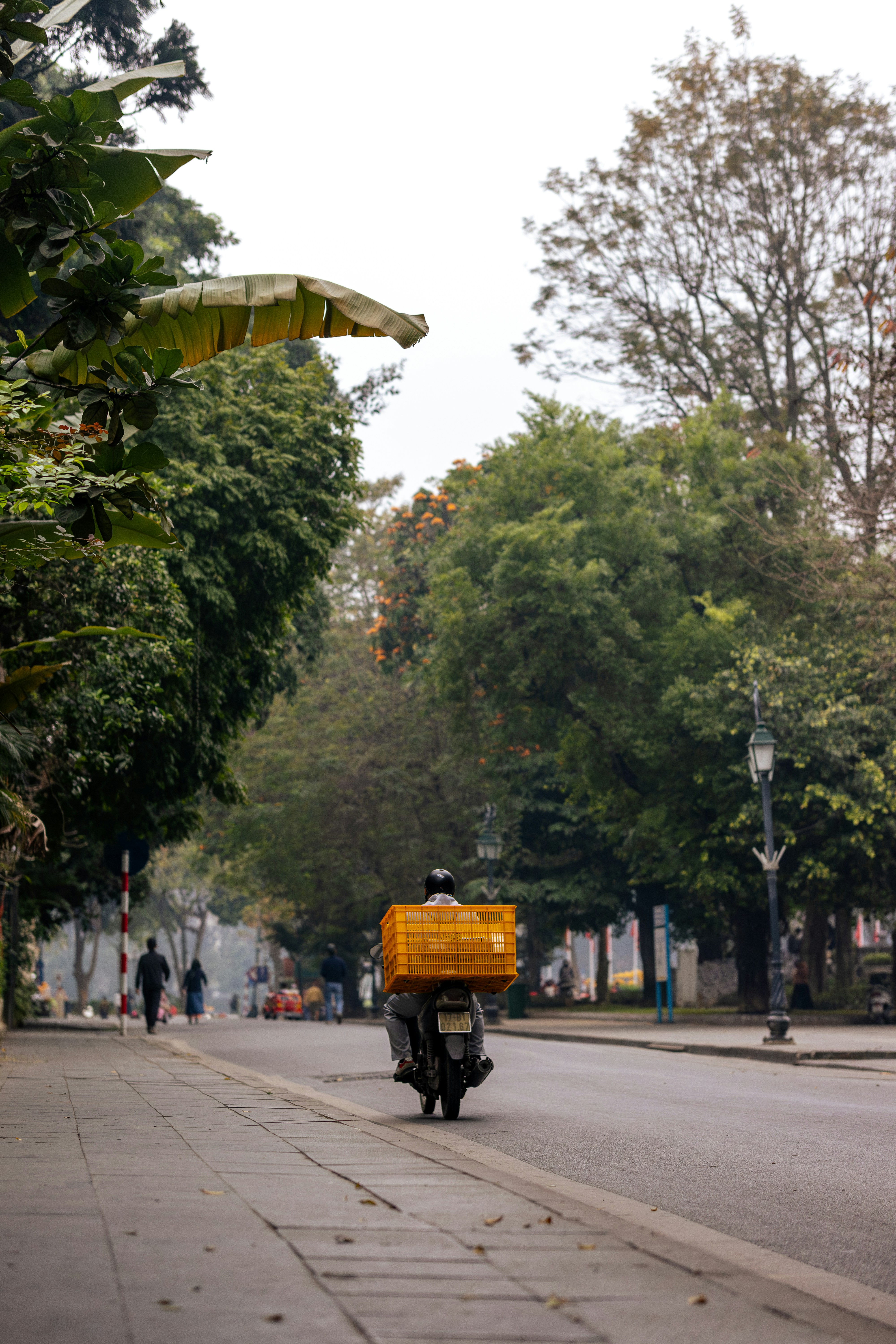 a person riding a motorcycle down a street
