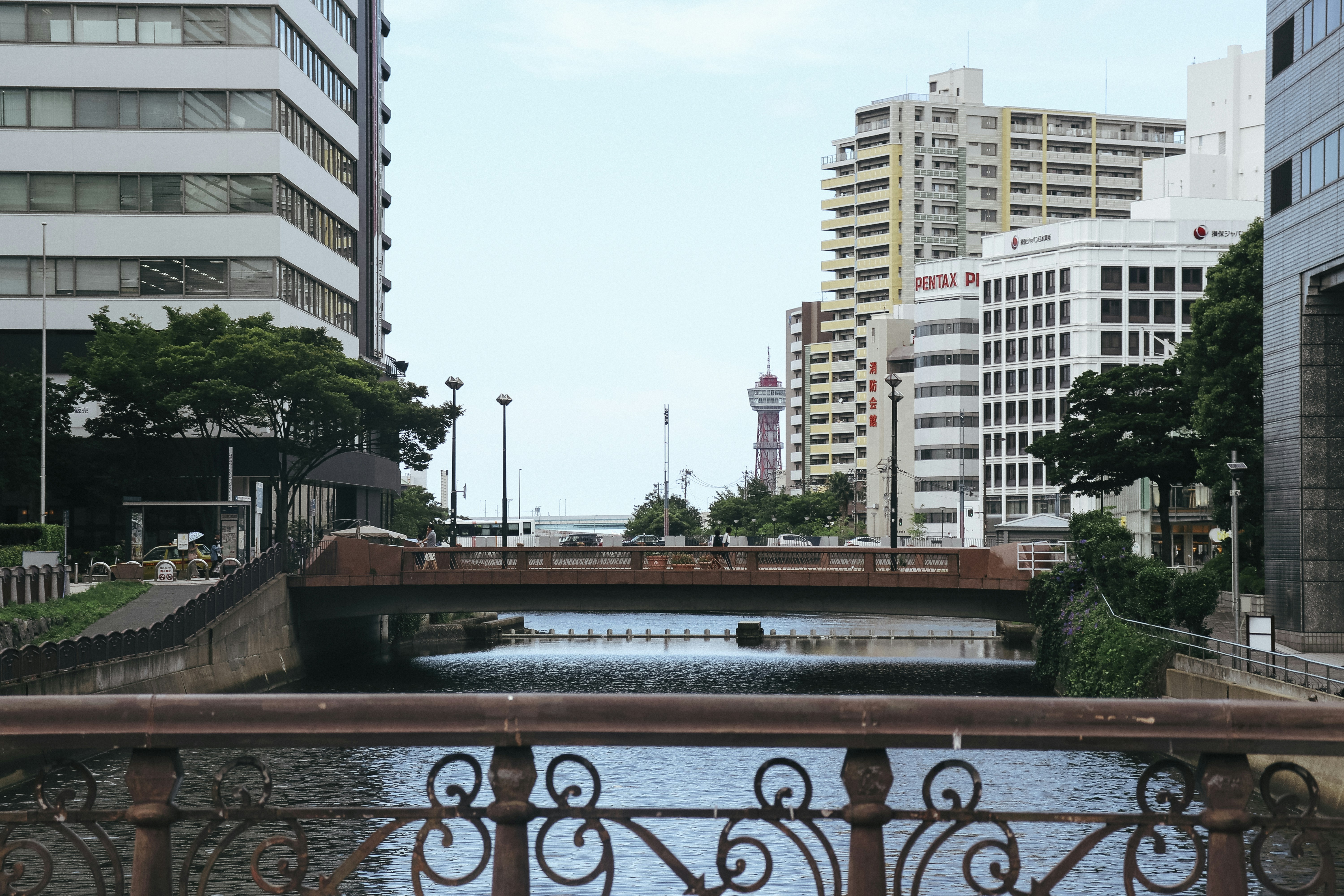 Canal Confluence: Iron Bridge Framing a Modern City
