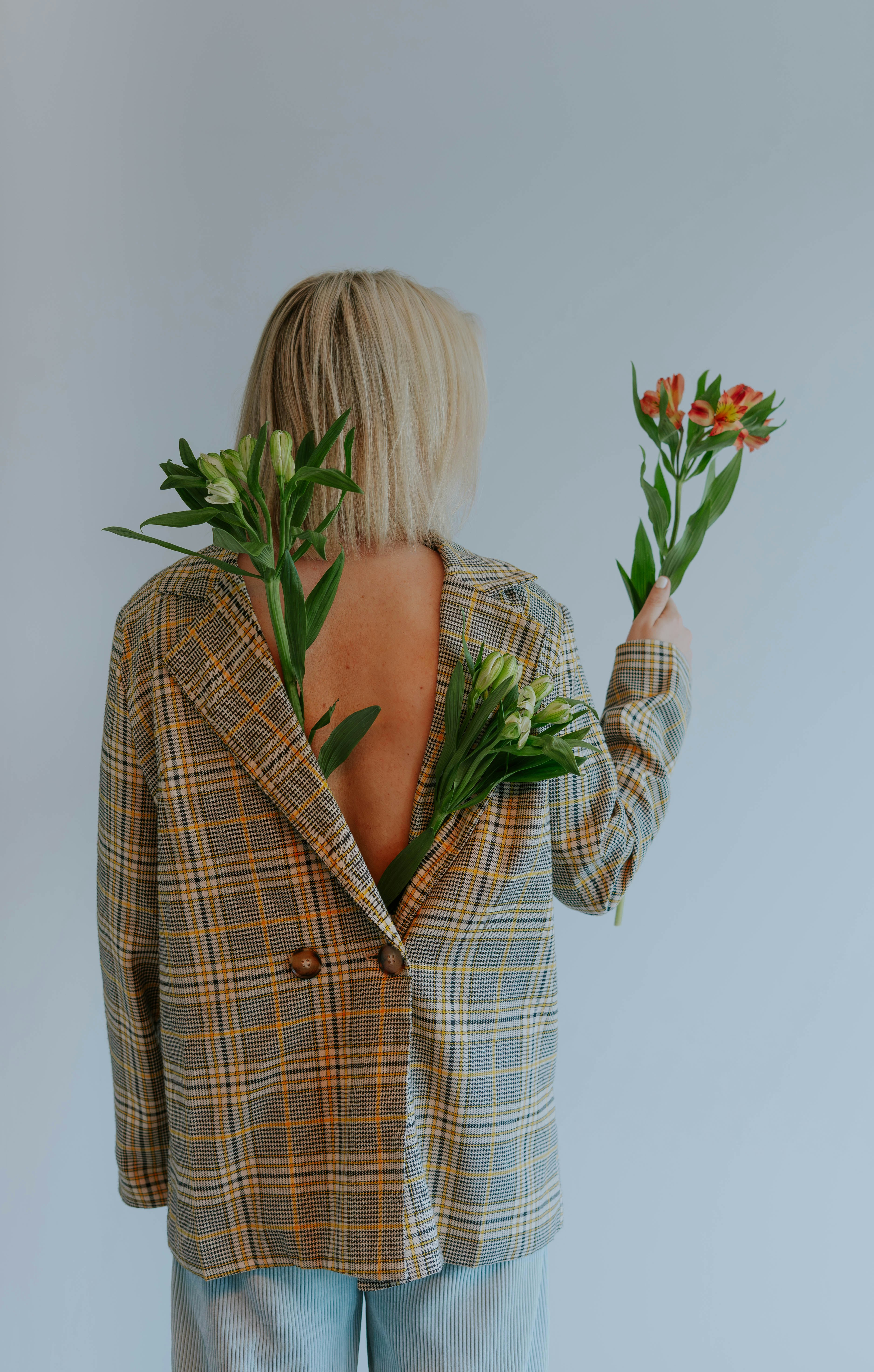 Floral Quietude: Blooms Hidden in an Open-Back Plaid Blazer