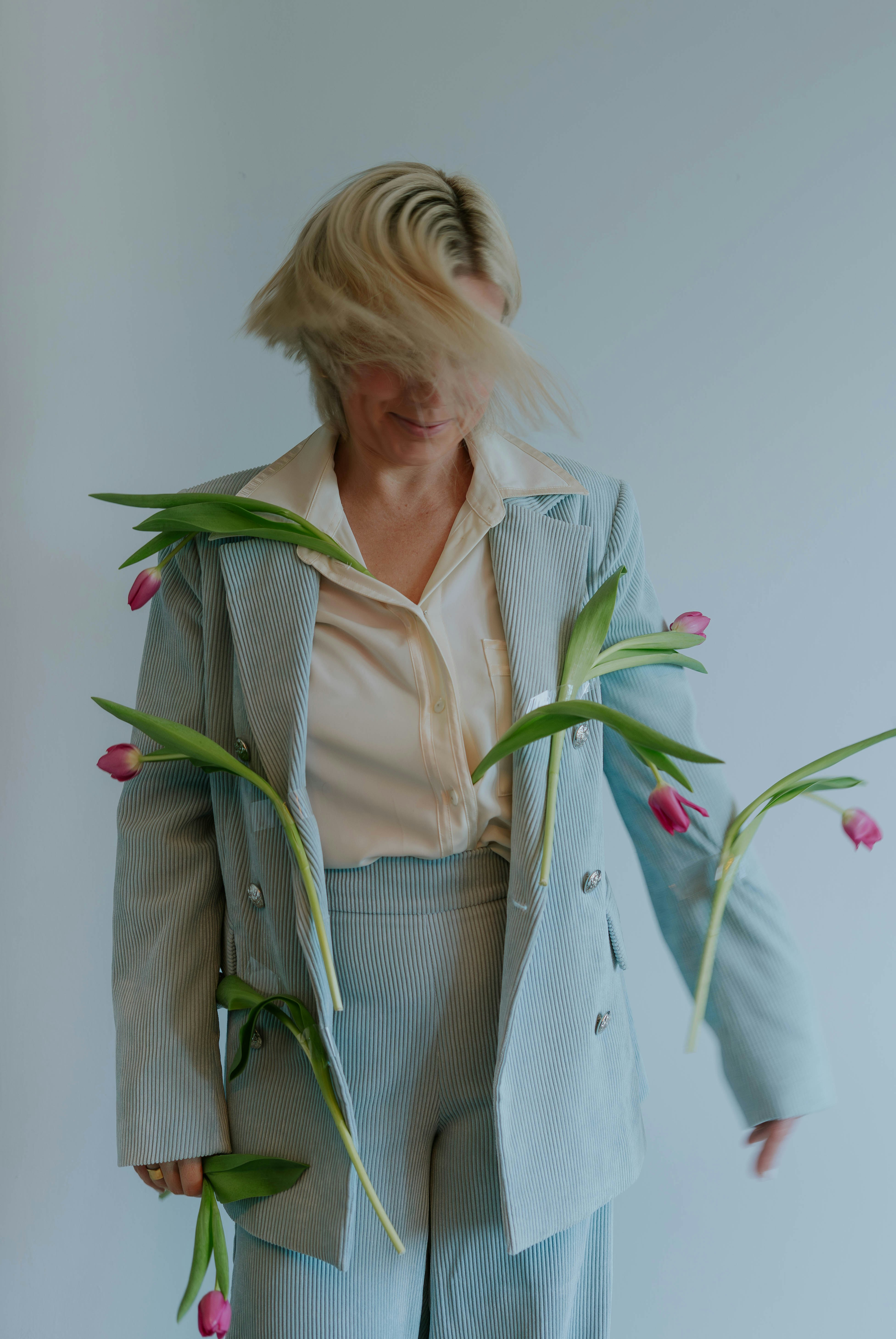 Windward in a Blue Suit: Tulips and Motion in a Quiet Portrait