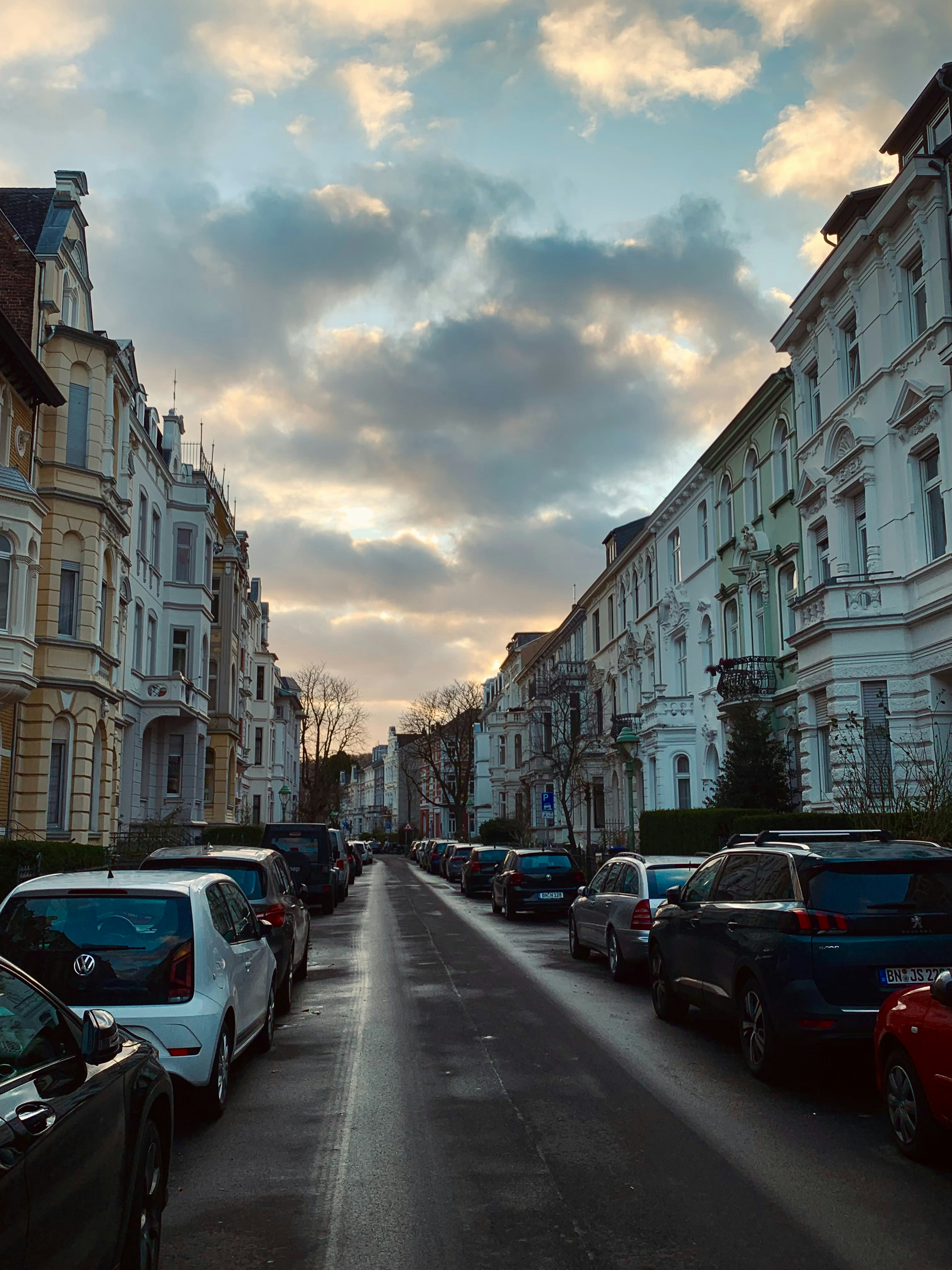 Vanishing Lane: Evening Light Between Classic Townhouses